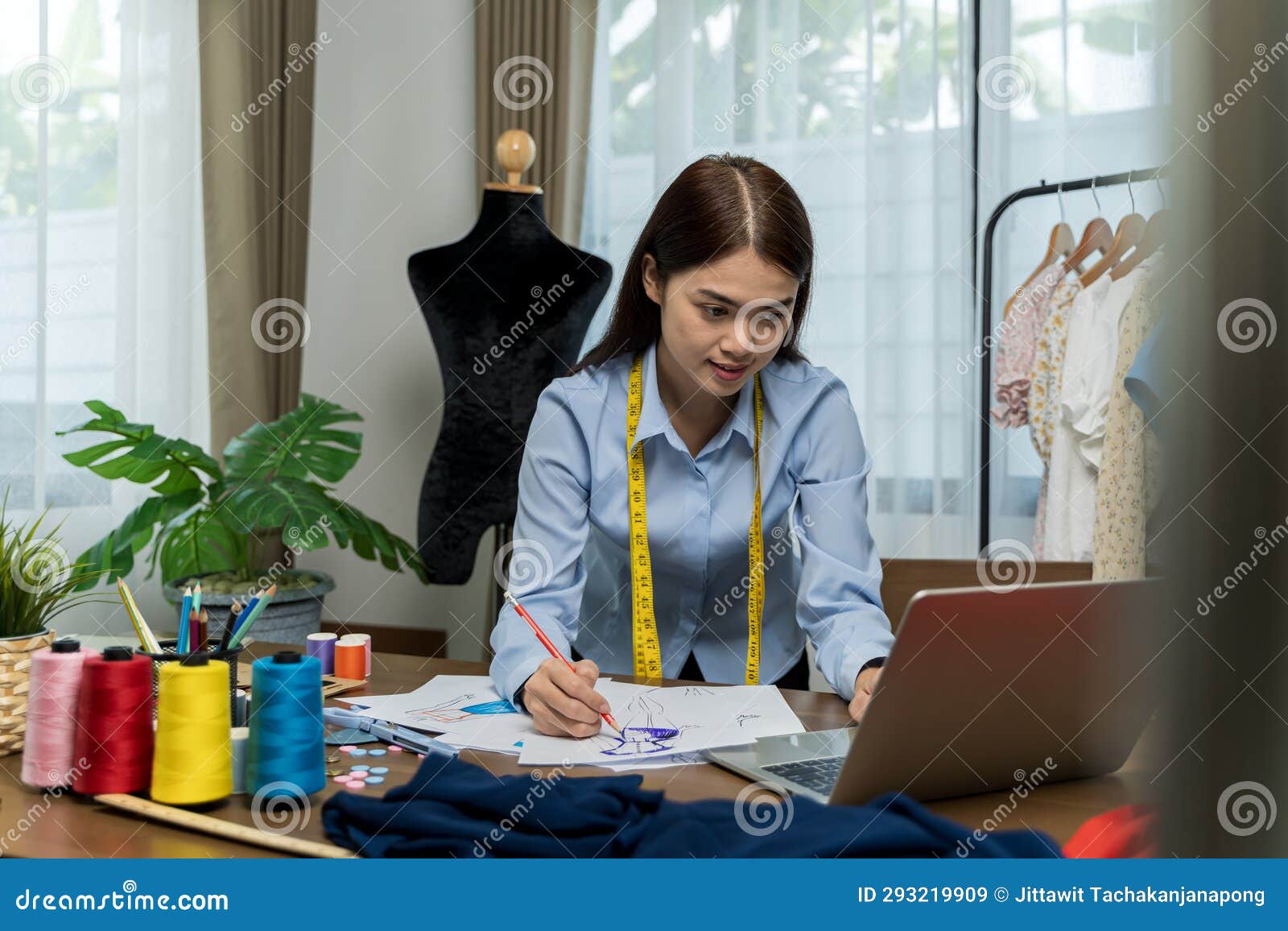 Female Designer of Clothes Standing by Sewing Machine in Atelier ...