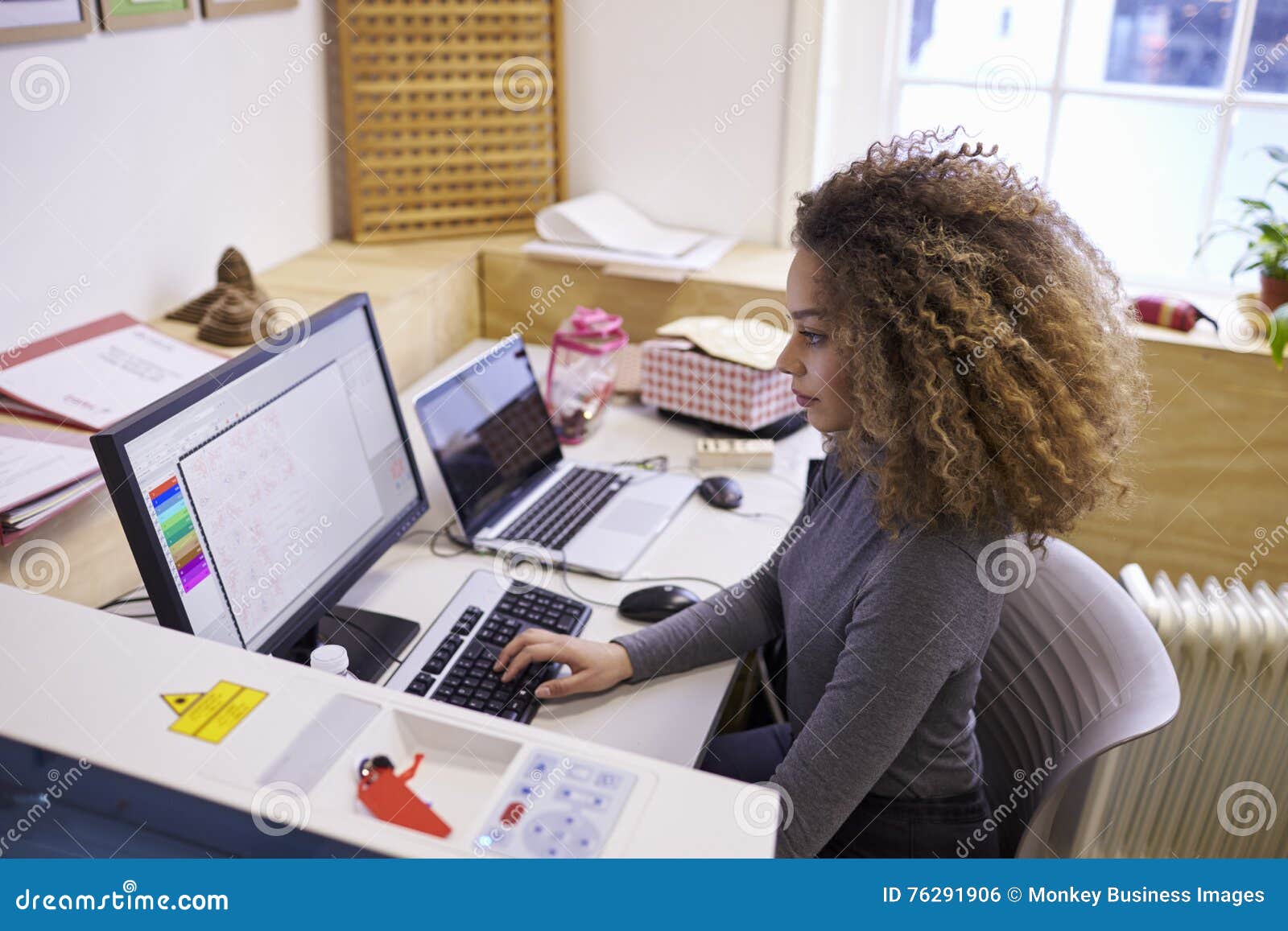 Female Designer Operating CAD System For Laser Cutter Royalty-Free ...