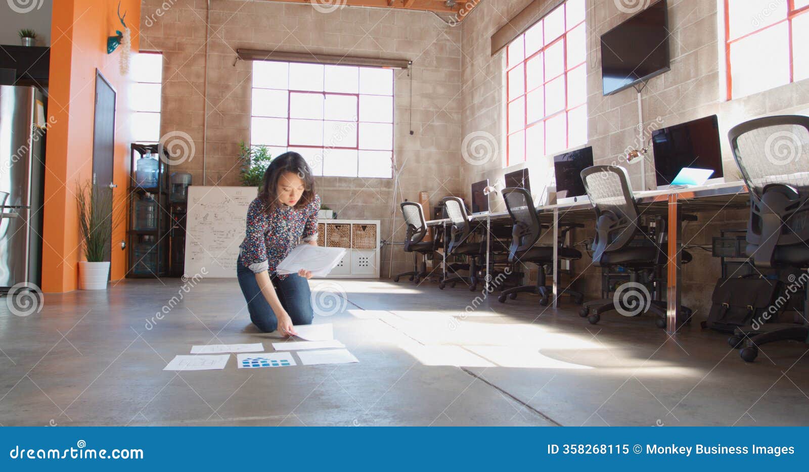 Female Designer Planning Campaign Laying Out Documents on Floor of ...