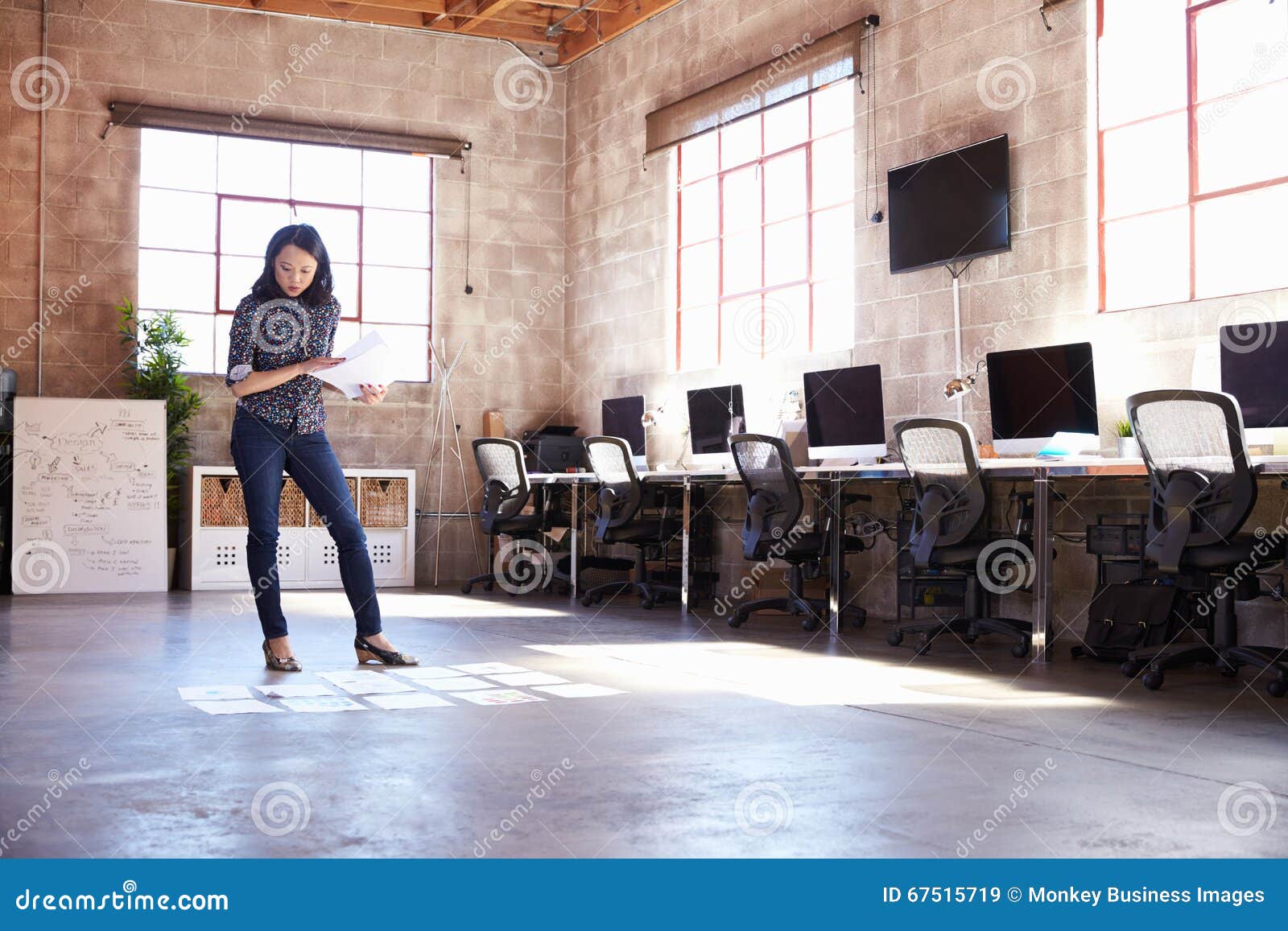 Female Designer Planning Layout on Floor of Modern Office Stock Image ...