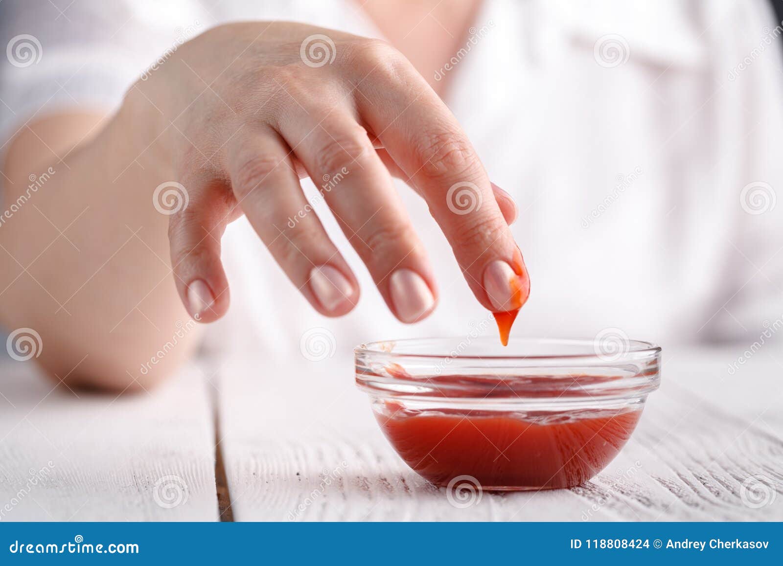 Female Dipping Finger in Tomato Ketchup Stock Photo - Image of glass ...