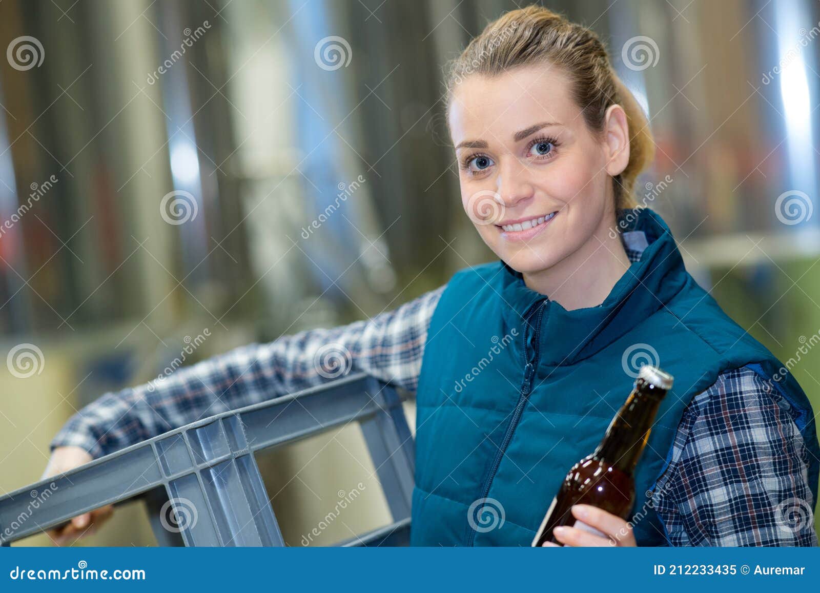 Female Distillery Worker Holding Bottled Beer Stock Image - Image of ...