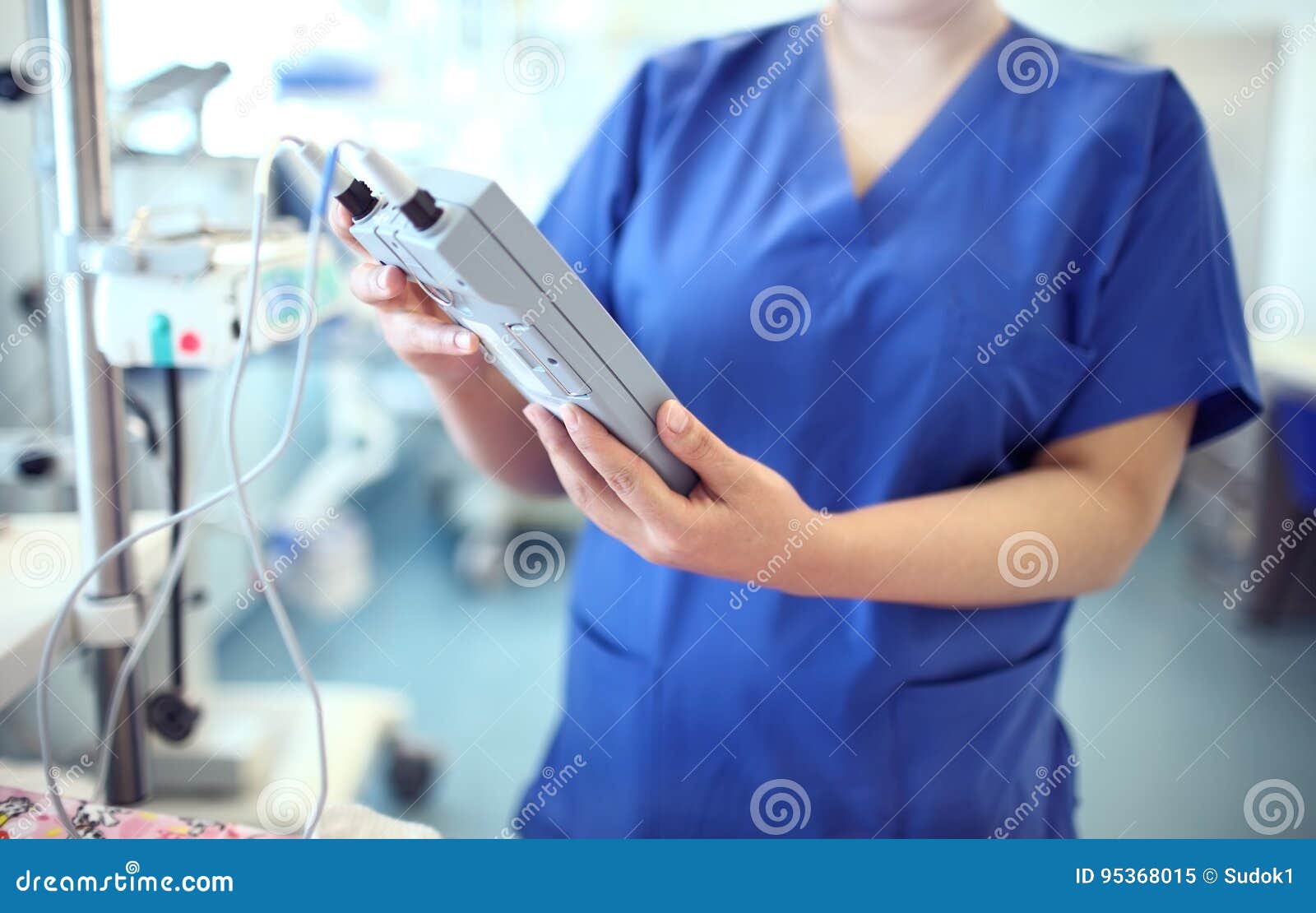 Female Doctor Adjust Electronic Medical Device Stock Image - Image of ...