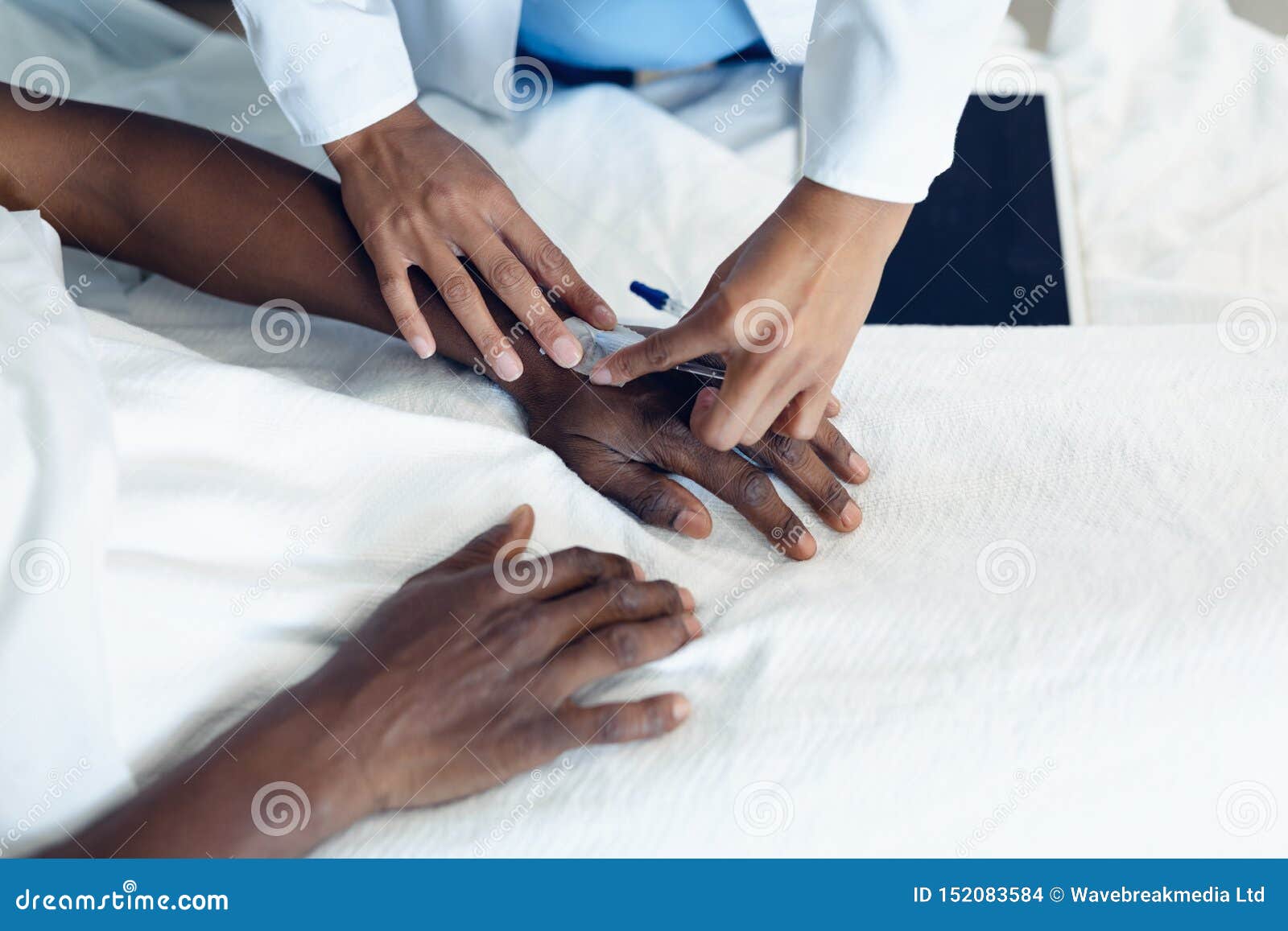 Female Doctor Attaching Iv Drip on Male Patient Hand in the Ward Stock ... Female Doctor Attaching Iv Drip on Male Patient Hand in the Ward Stock ...