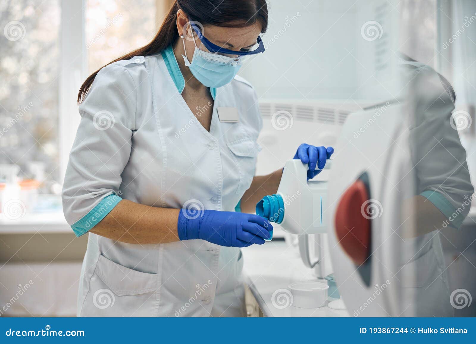 Female Doctor with Bottle of Solution for Work with Instruments Stock ...