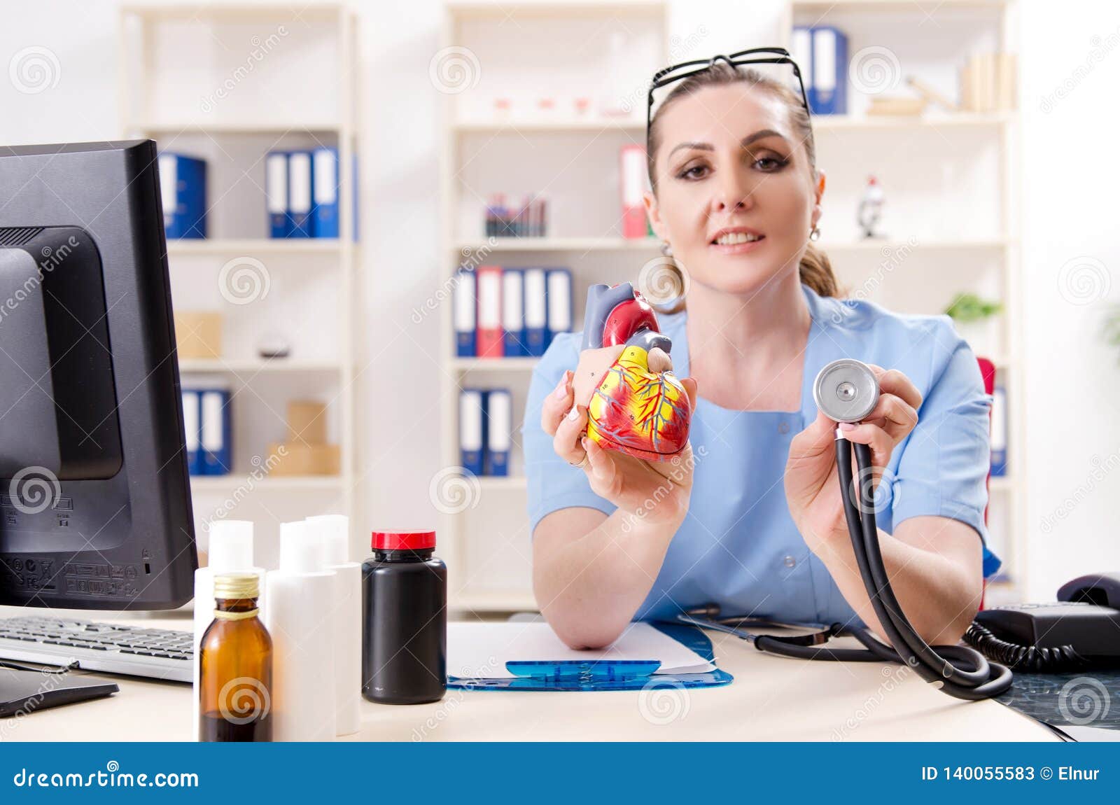 The Female Doctor Cardiologist Working in the Clinic Stock Image ...