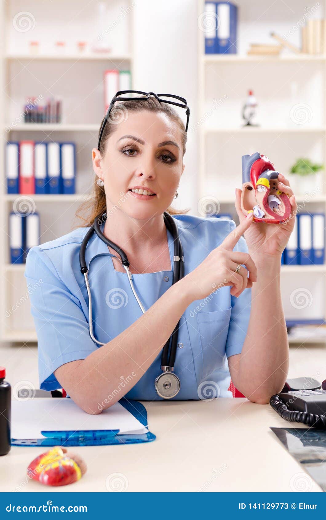 The Female Doctor Cardiologist Working in the Clinic Stock Image ...