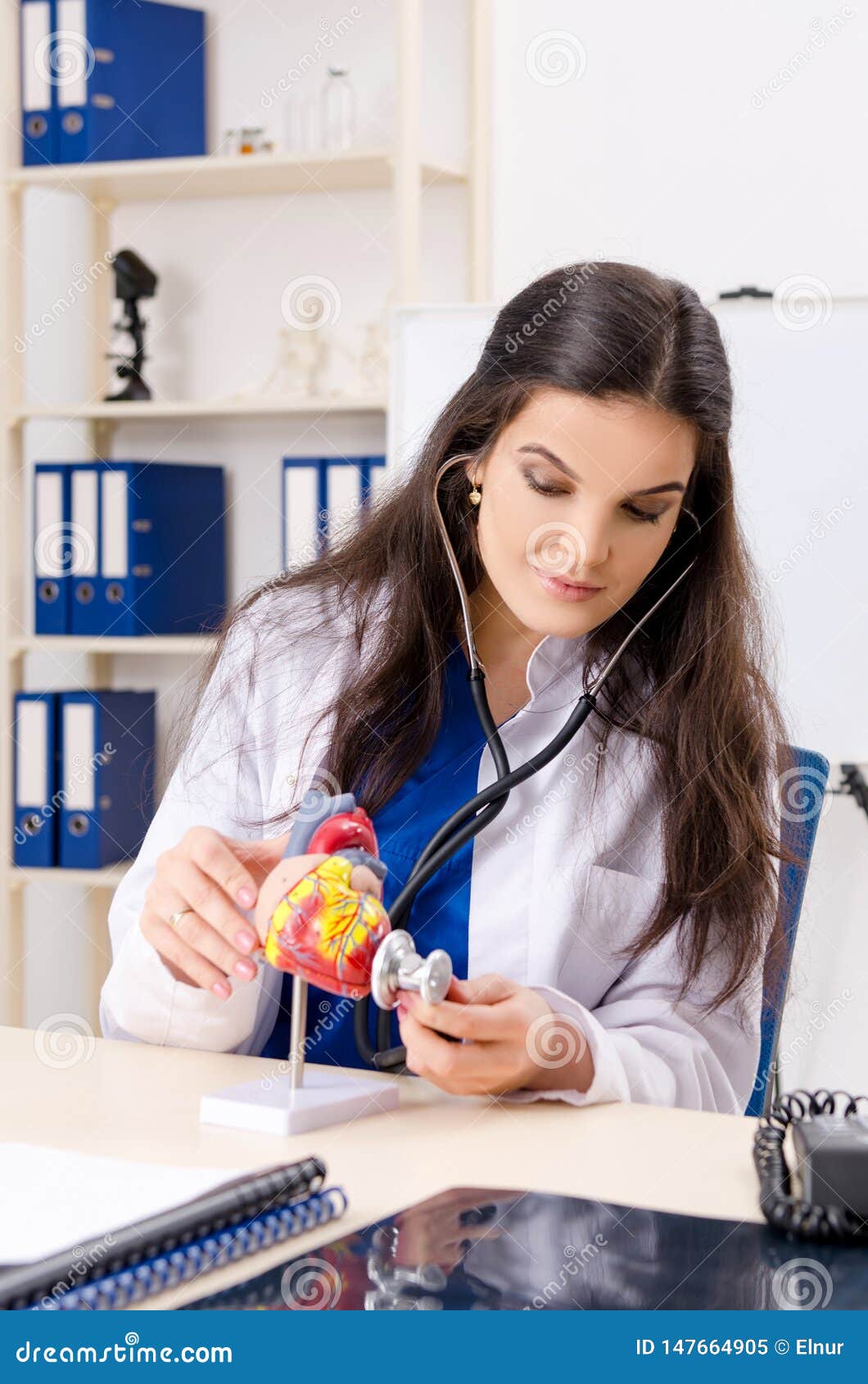 The Female Doctor Cardiologist Working in the Clinic Stock Image ...