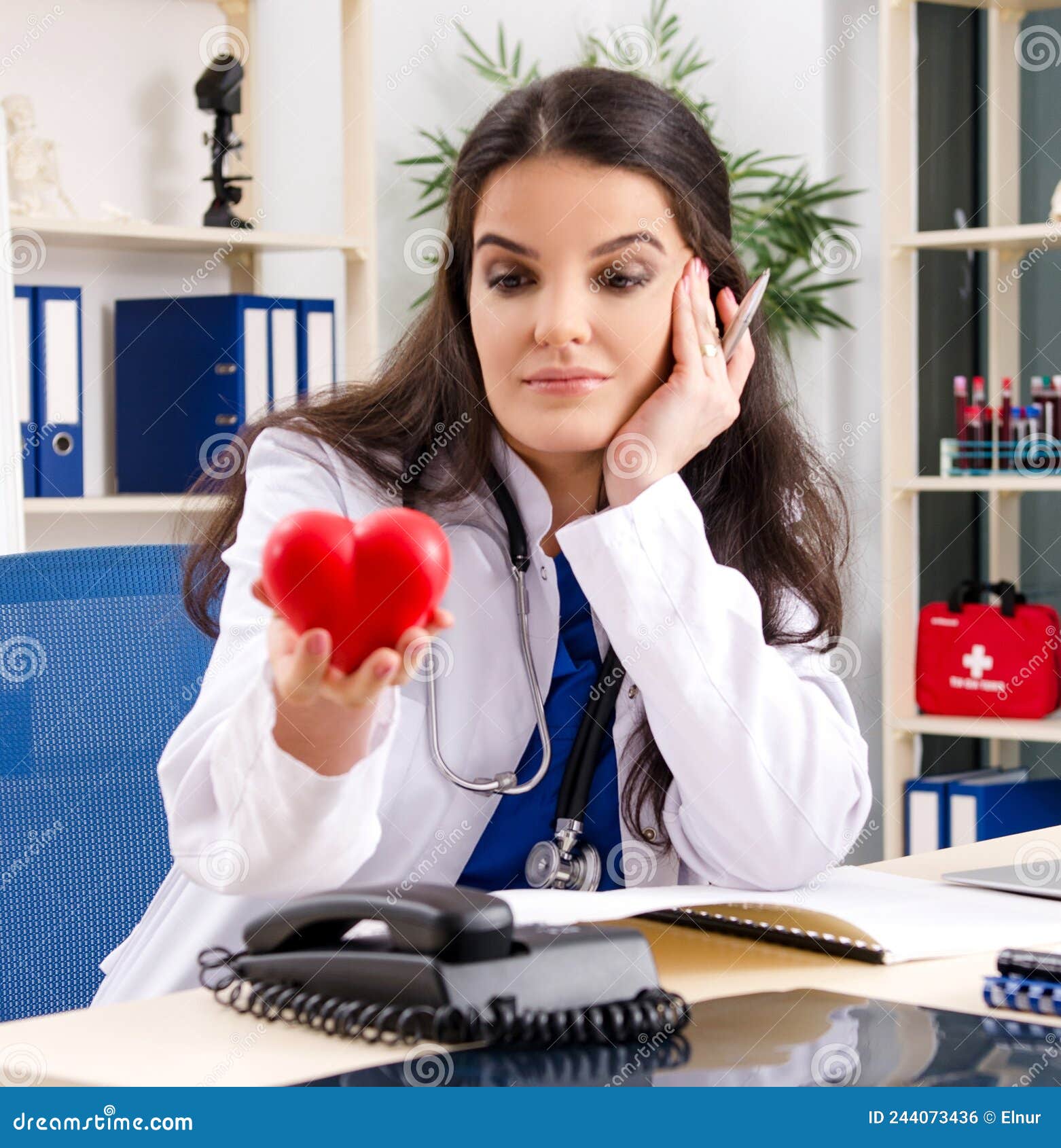 The Female Doctor Cardiologist Working in the Clinic Stock Photo ...