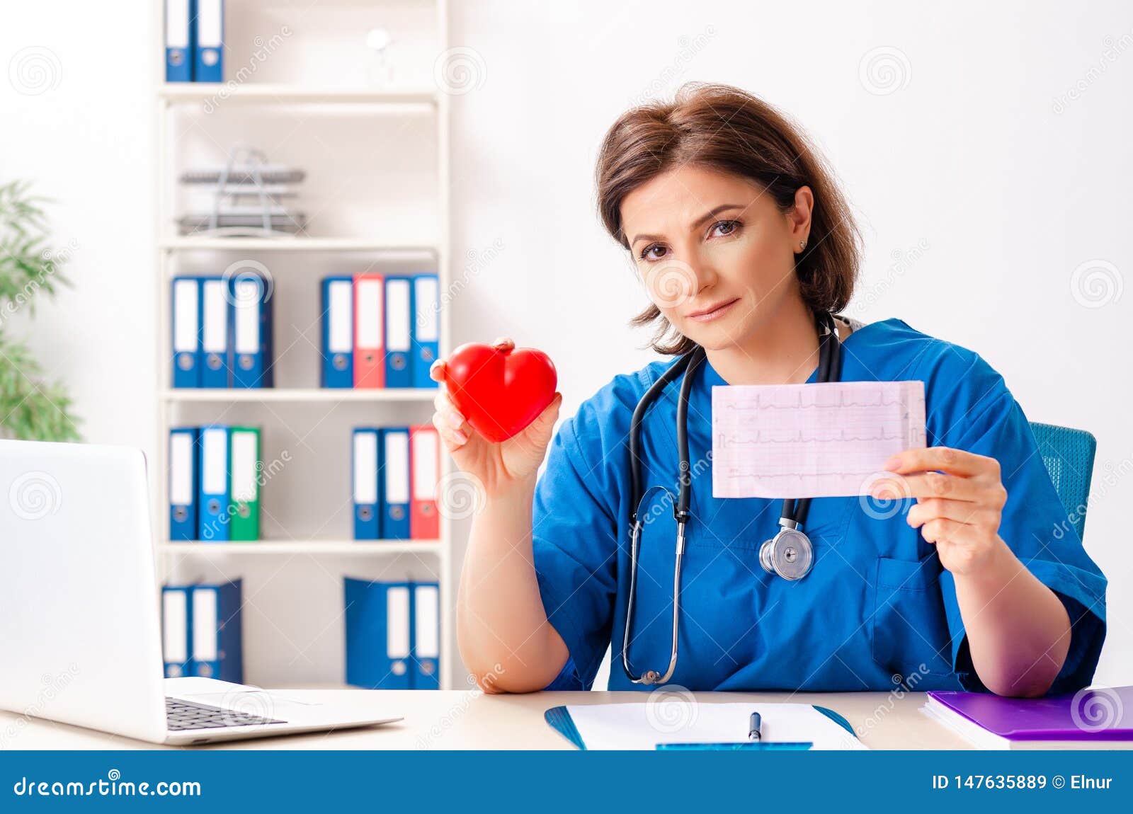 The Female Doctor Cardiologist Working in the Hospital Stock Image ...
