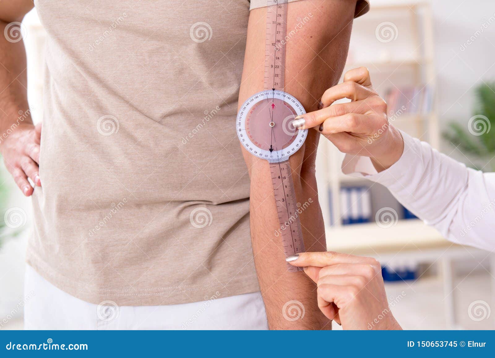 The Female Doctor Checking Patient`s Joint Flexibility with Goniometer ...