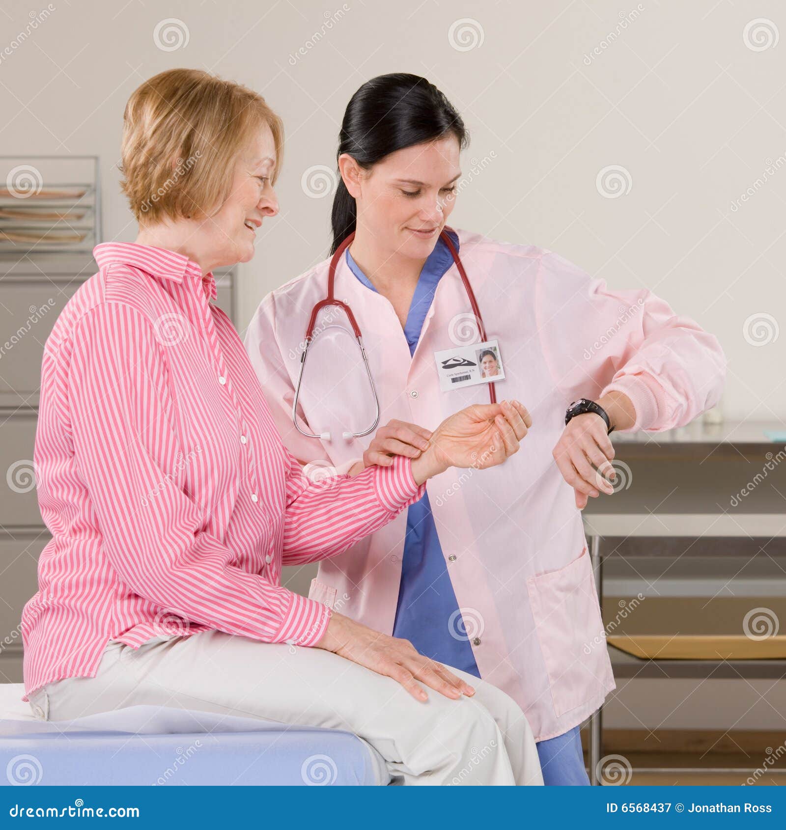 Female Doctor Checking Womans Pulse during Check Stock Image - Image of ...