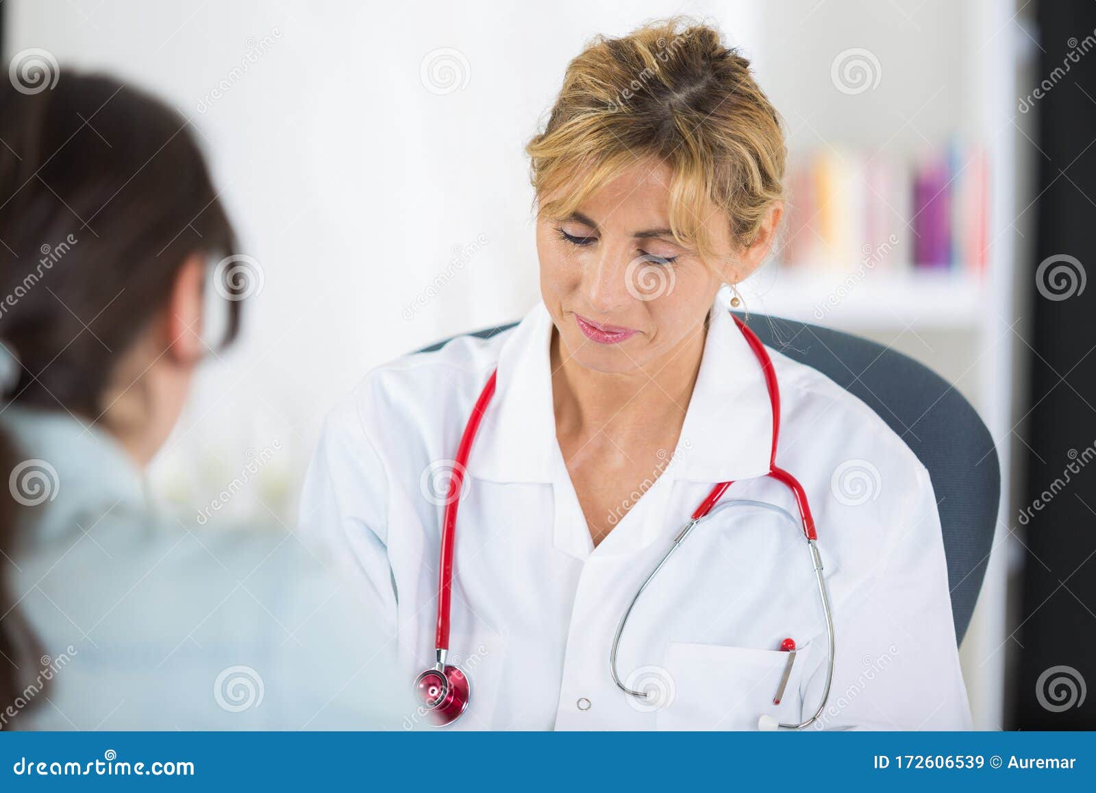 Female Doctor in Consultation with Patient Stock Image - Image of woman ...
