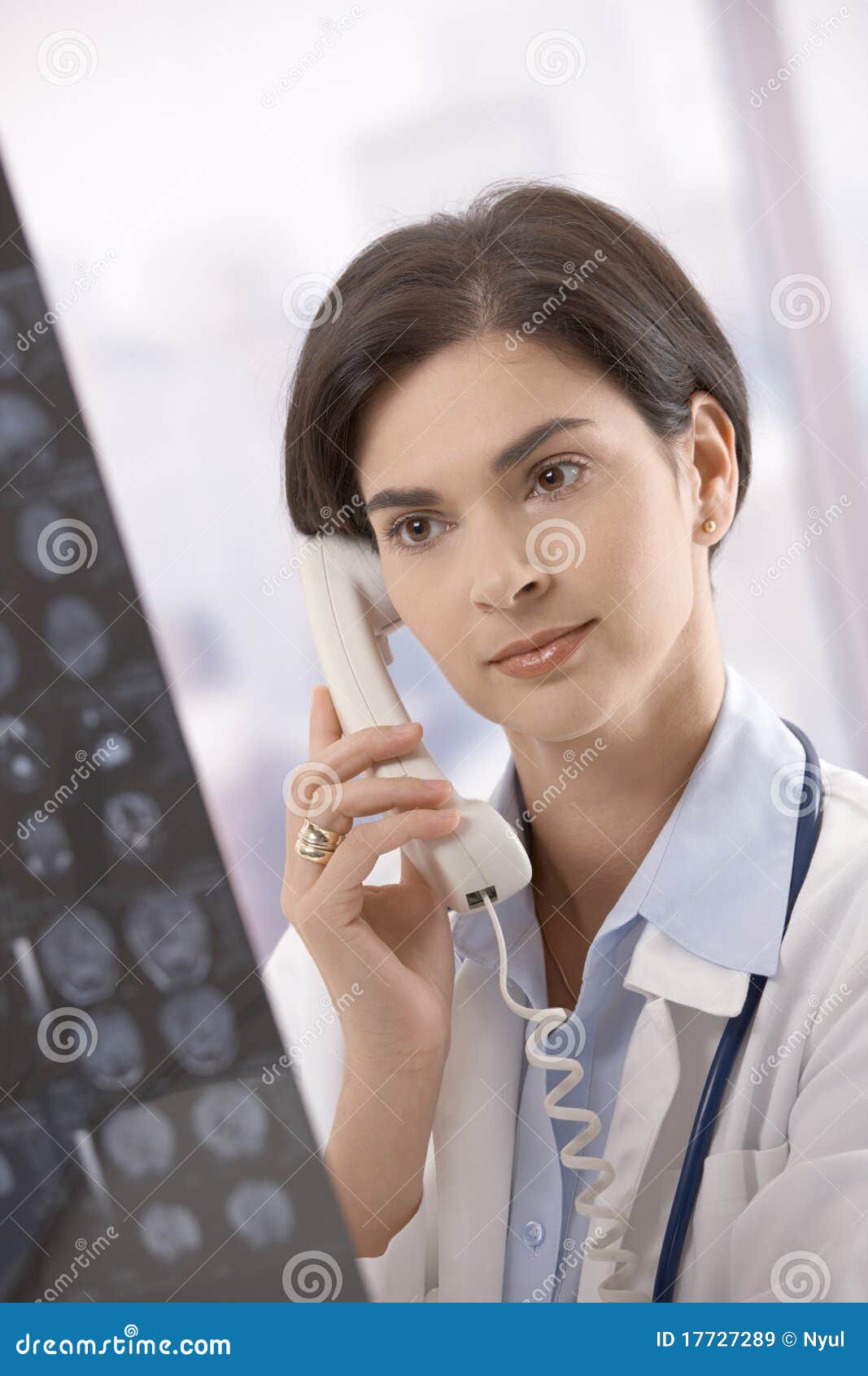 Female Doctor Consulting on Phone Stock Image - Image of beautiful ...