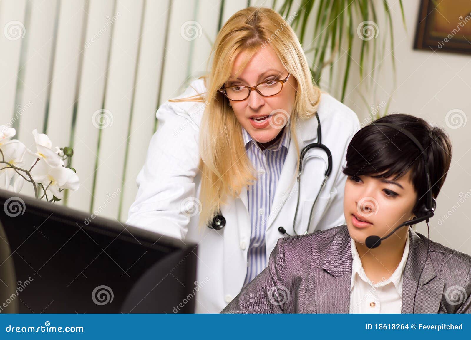 Female Doctor Discusses Work with Receptionist Stock Photo - Image of ...