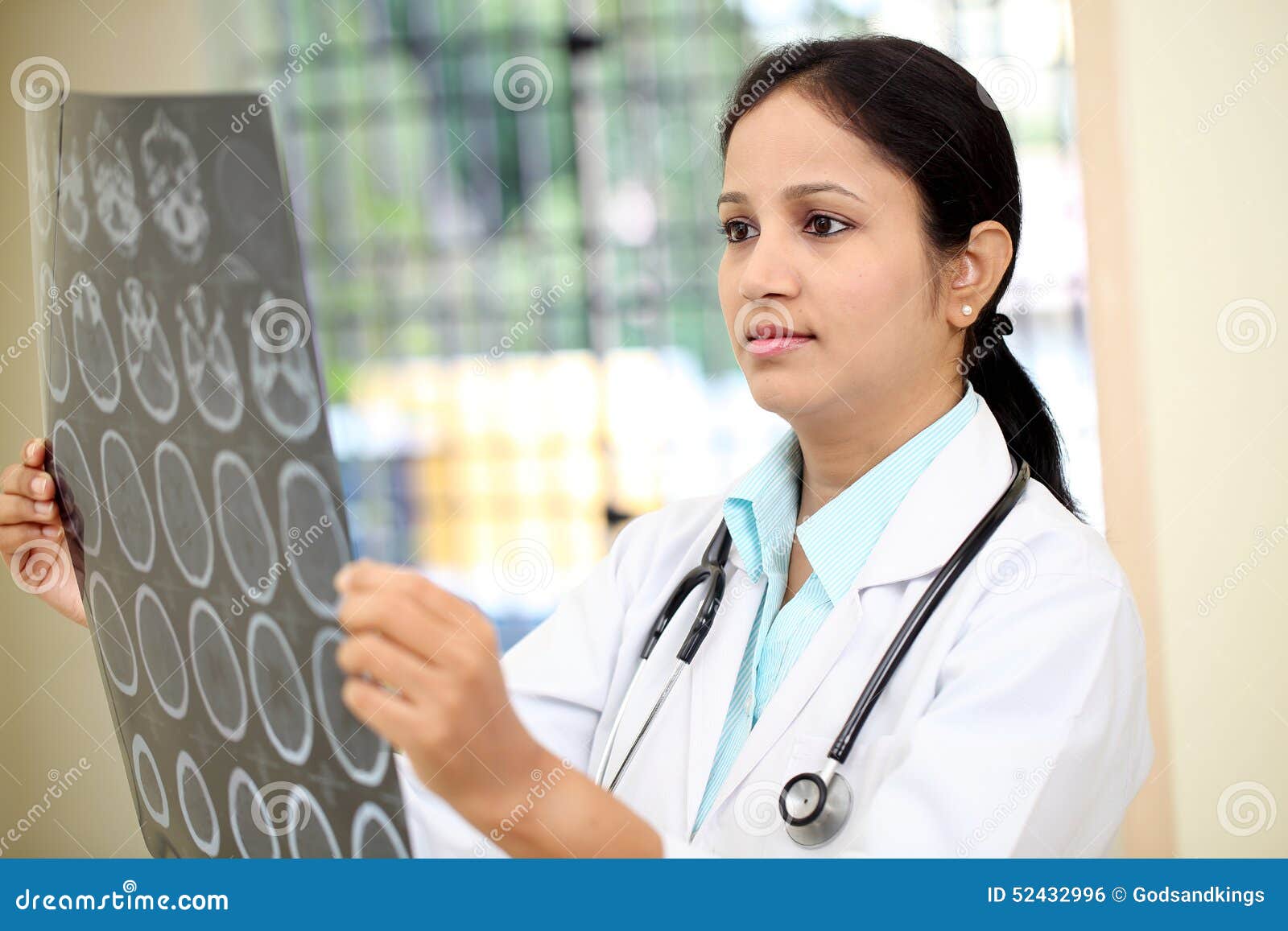 Female Doctor Examining A Brain Scan Royalty-Free Stock Image ...