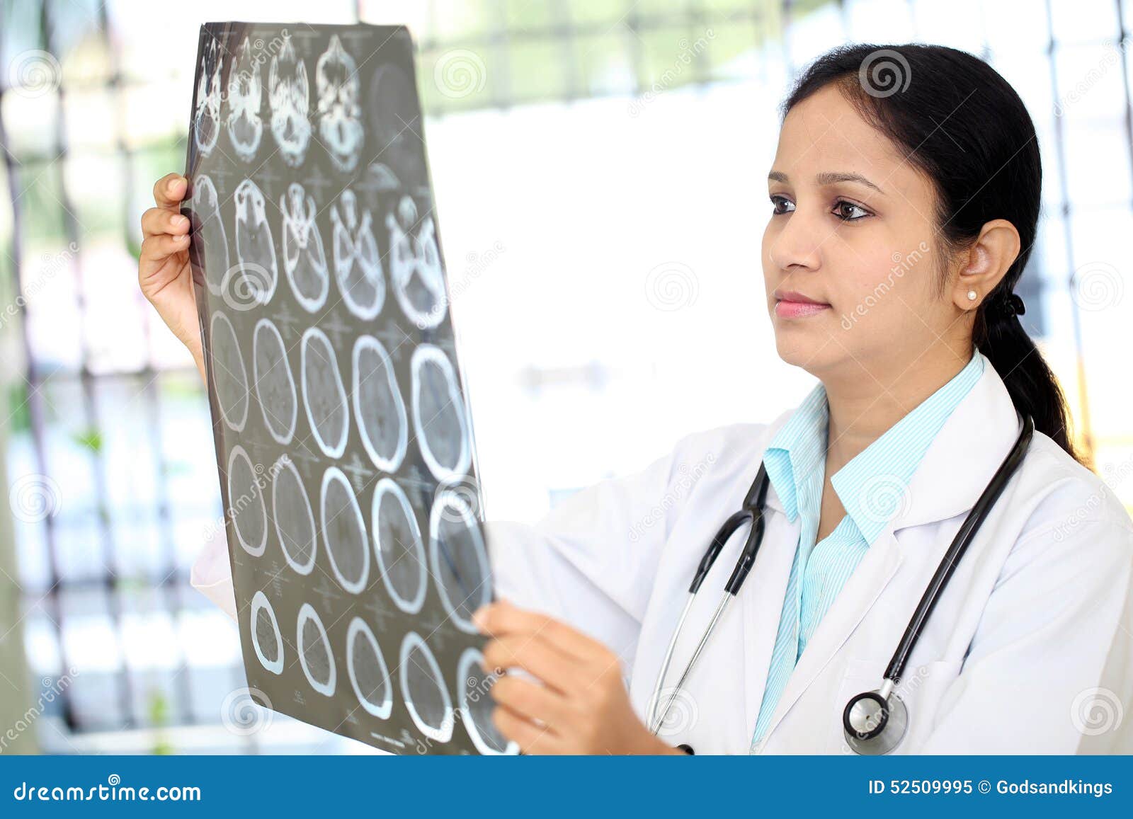 Female Doctor Examining a Brain Tomography Scan Stock Image - Image of ...