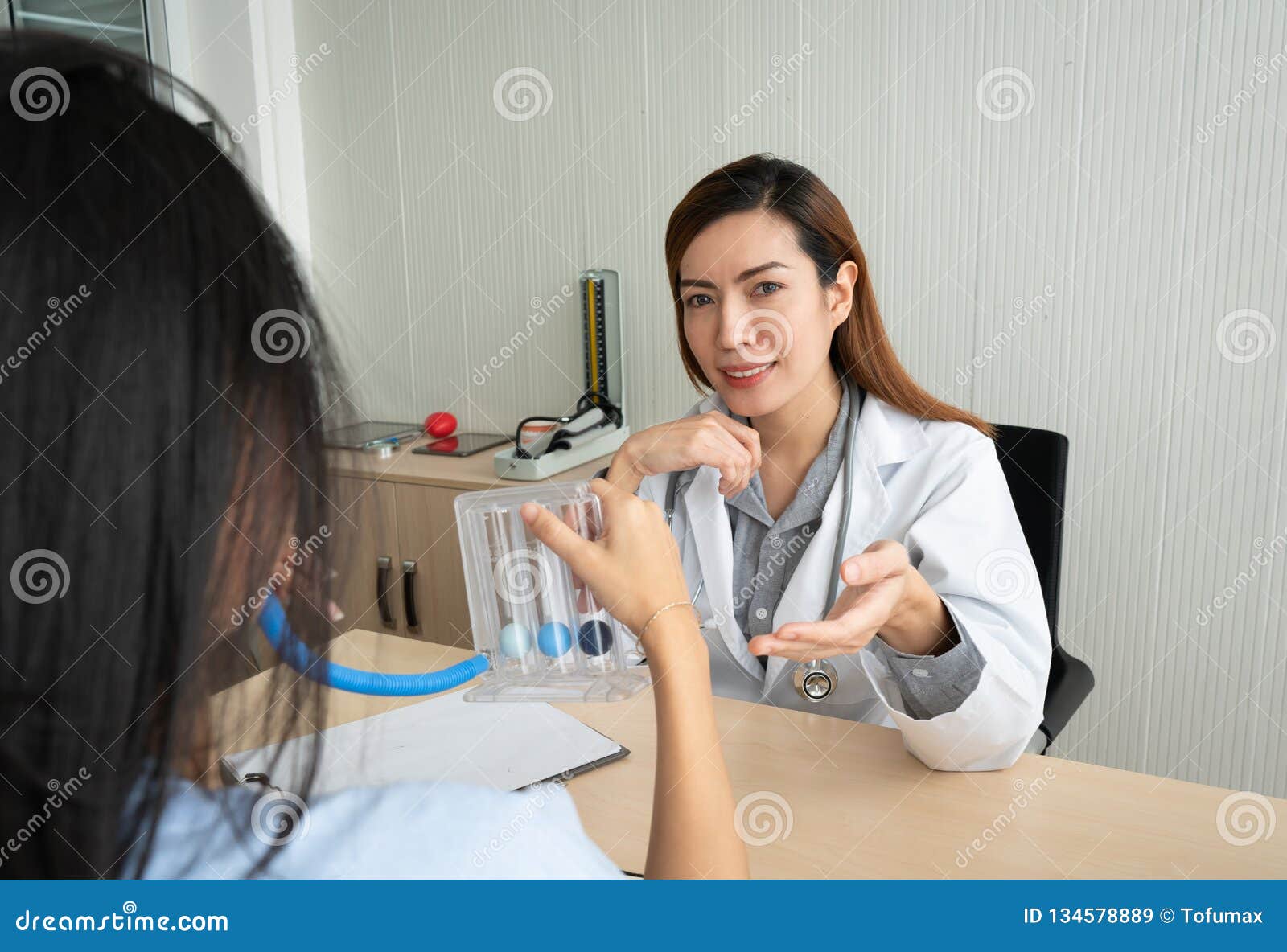 Female Doctor Explaining To Patient Stock Image - Image of exercise ...