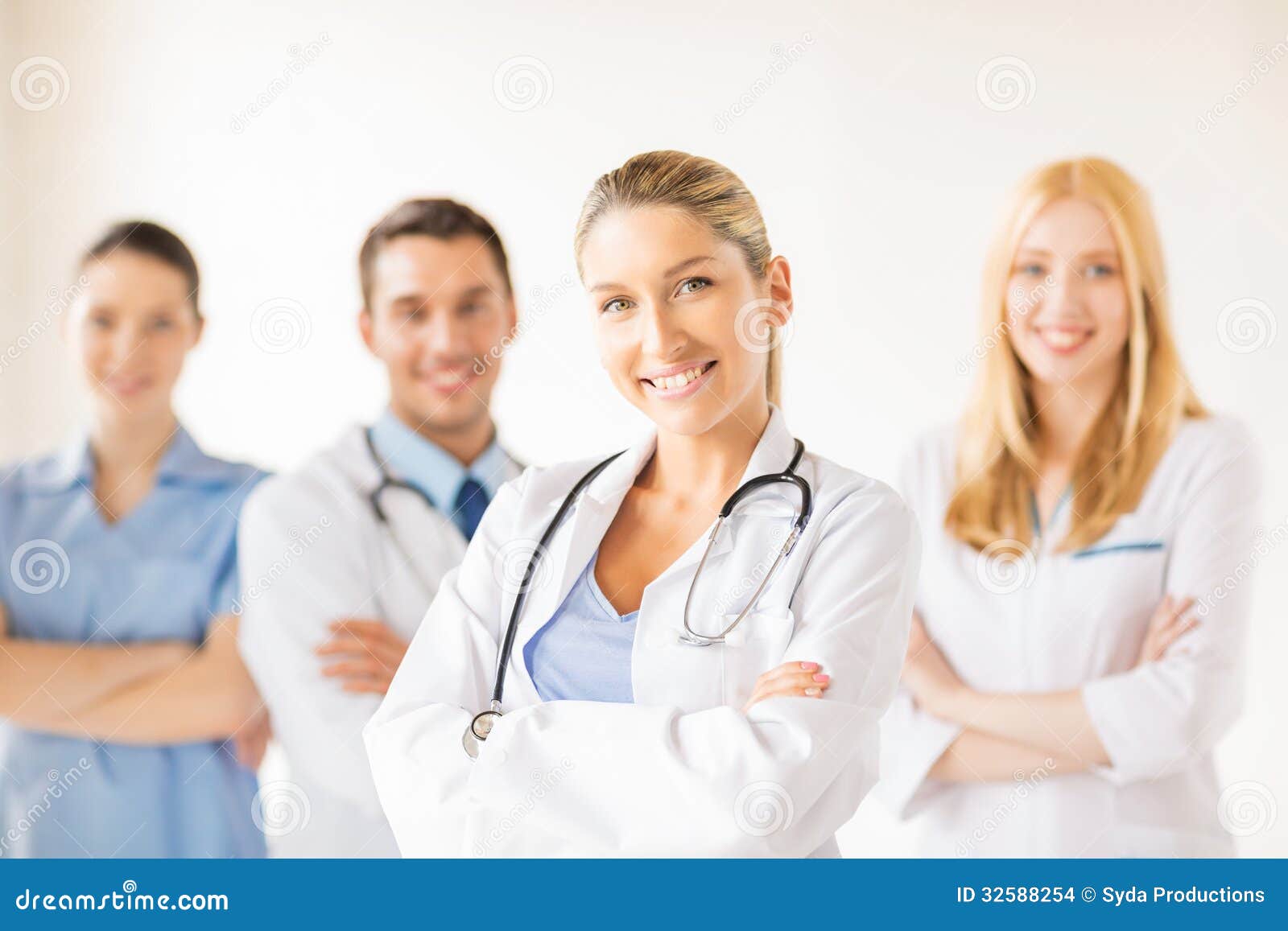 Female Doctor in Front of Medical Group Stock Photo - Image of medics ...