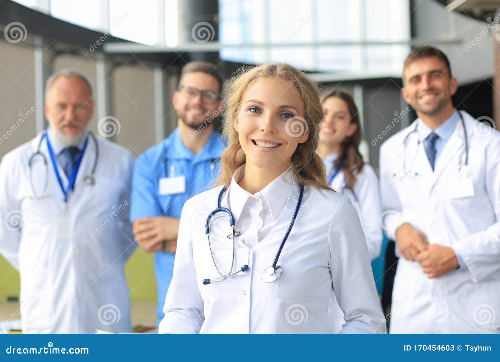 Female Doctor with Group of Happy Successful Colleagues Stock Image ...