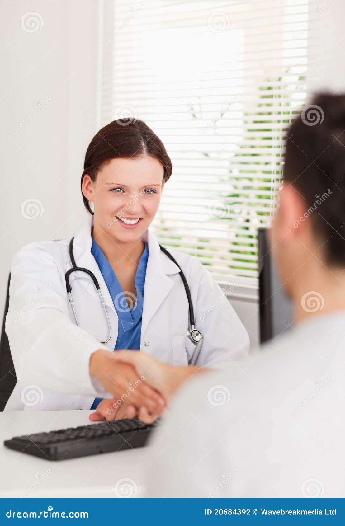 Female Doctor Hand Shaking with a Patient Stock Photo - Image of office ...