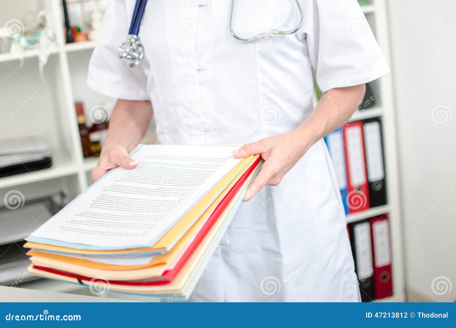 Female Doctor Holding Files Stock Photo - Image of folders, clinic ...
