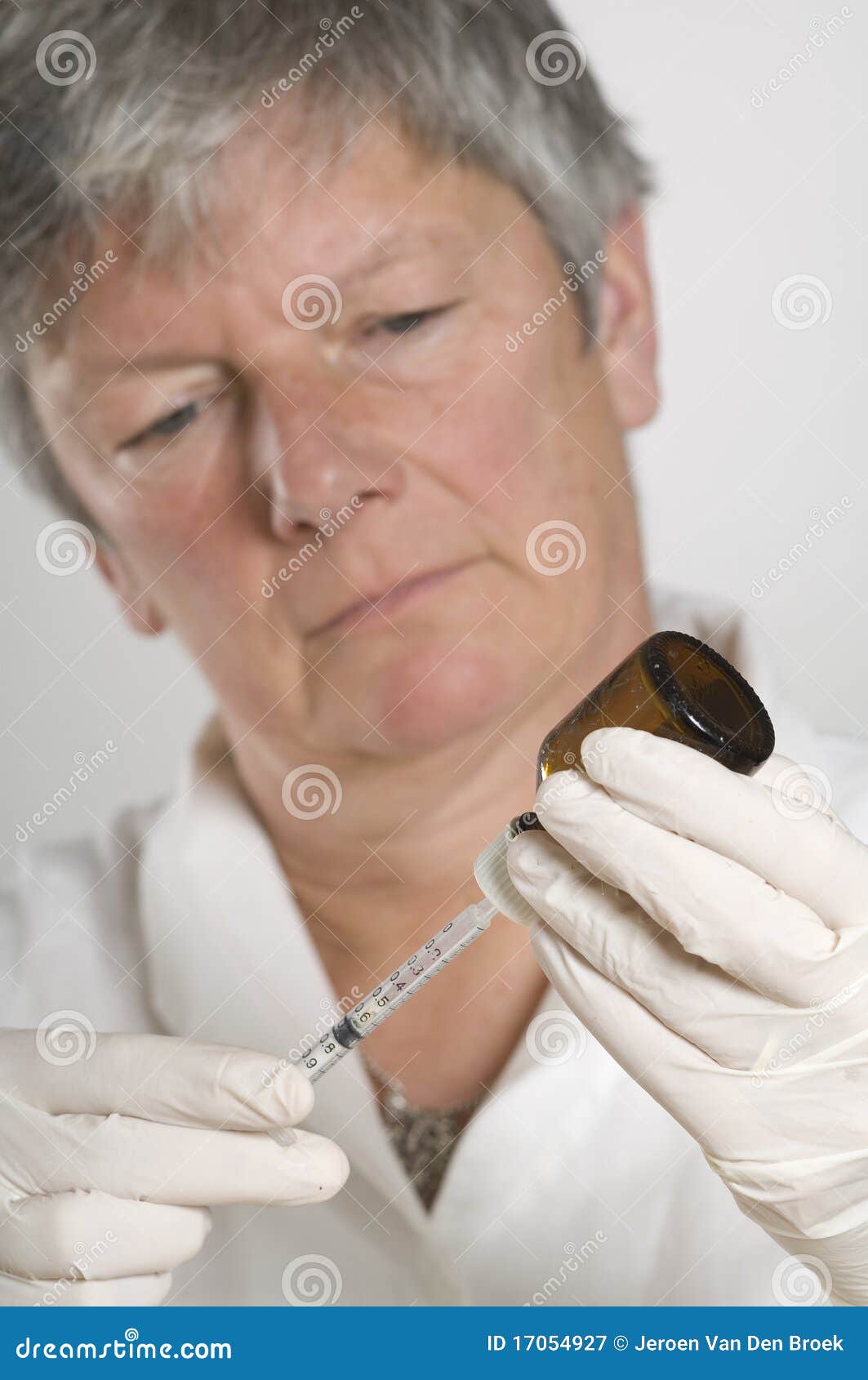 Female Doctor Holding Needle and Bottle Stock Image - Image of cute ...