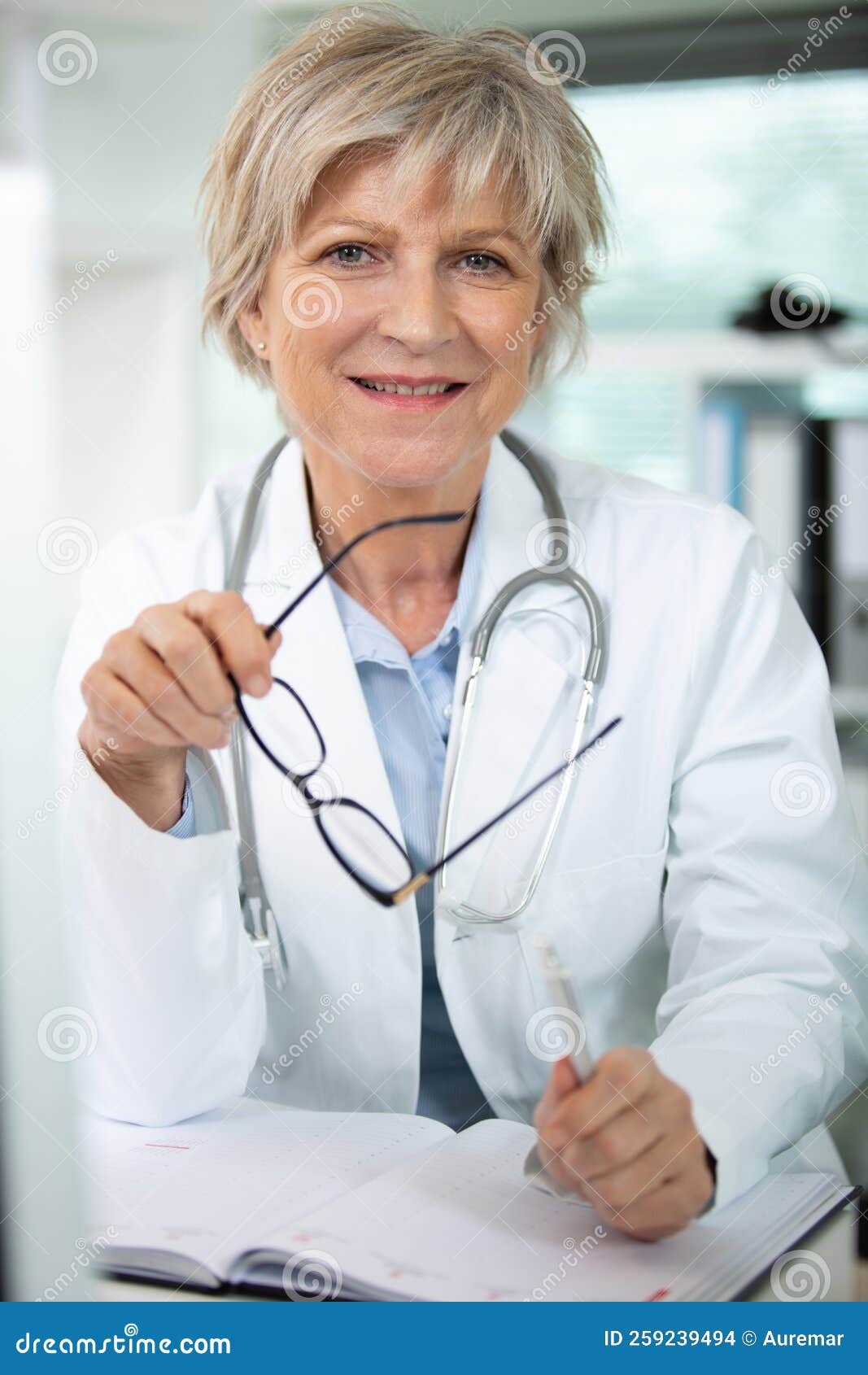 Female Doctor Looking at Camera Stock Photo - Image of working ...