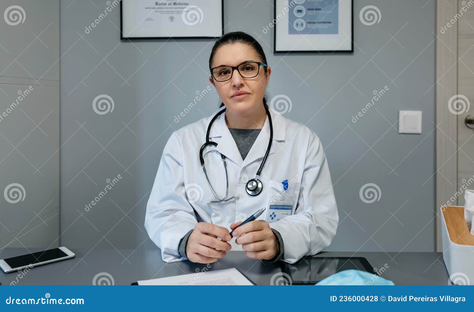 Female Doctor Looking at Camera in Her Office Stock Photo - Image of ...