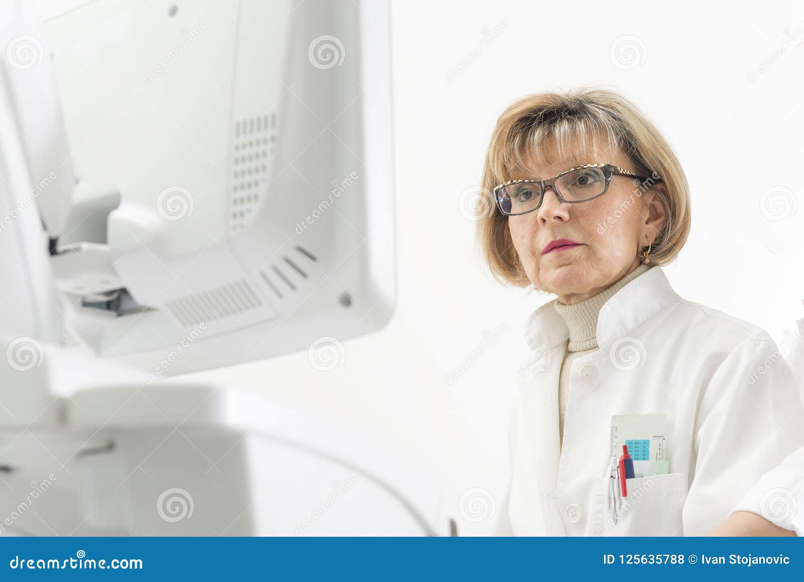 Female Doctor and Echocardiography Machine Stock Photo - Image of graph ...
