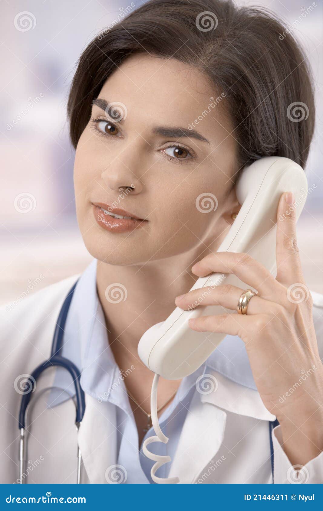 Female doctor on the phone stock image. Image of beautiful - 21446311