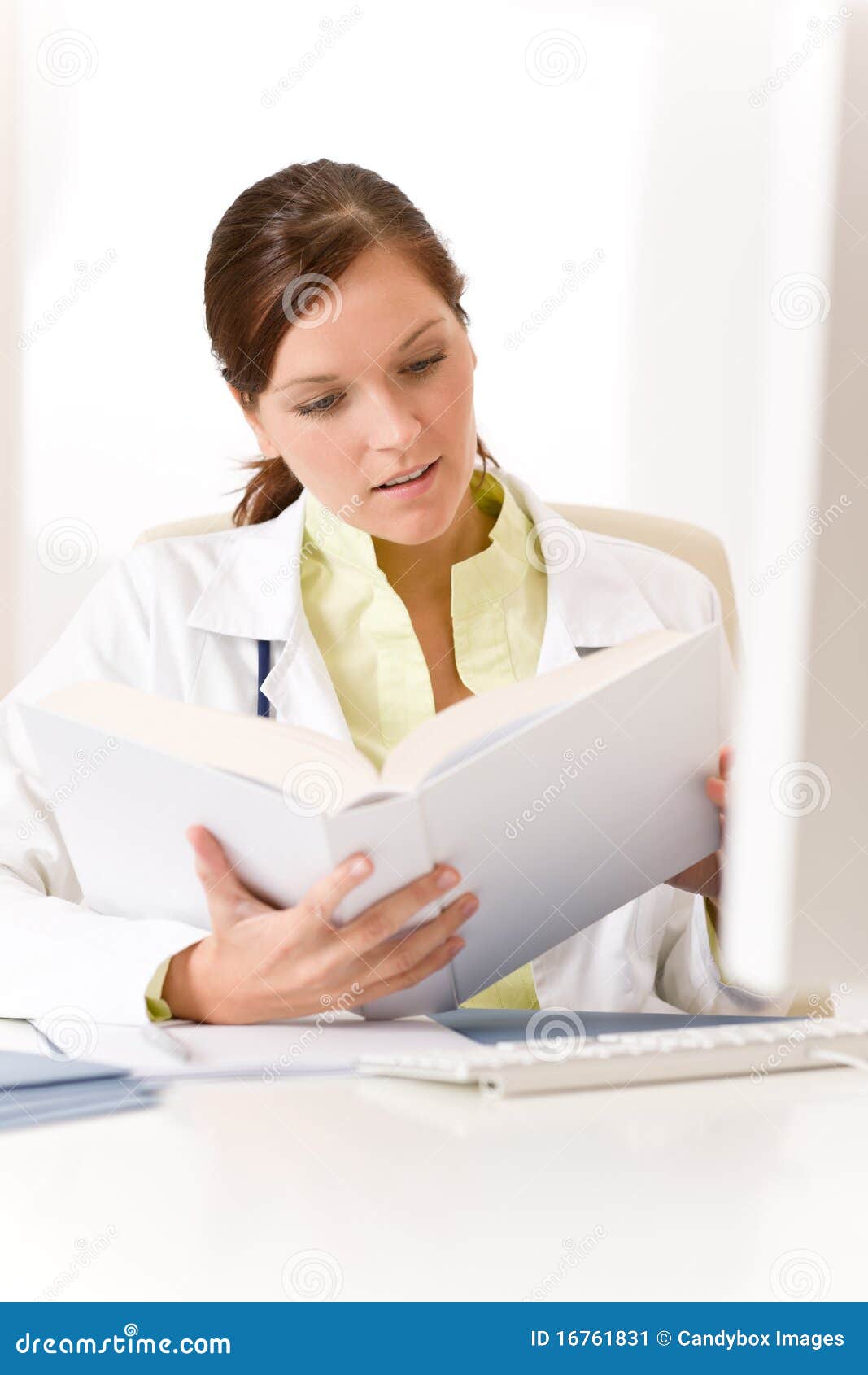 Female Doctor Read Book in Clinic Stock Image - Image of brunette ...