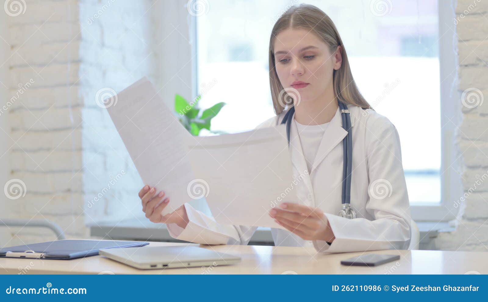 Female Doctor Reading Documents in Clinic, Paperwork Stock Footage ...