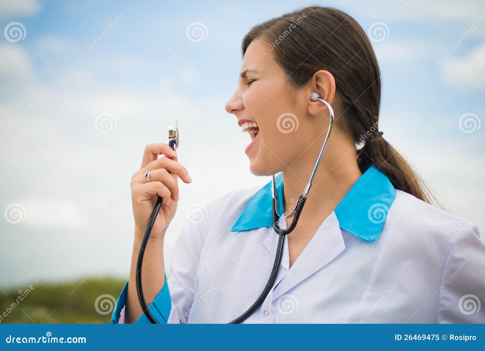 Female Doctor Singing in Stethoscope Over Blue Sky Stock Image - Image ...
