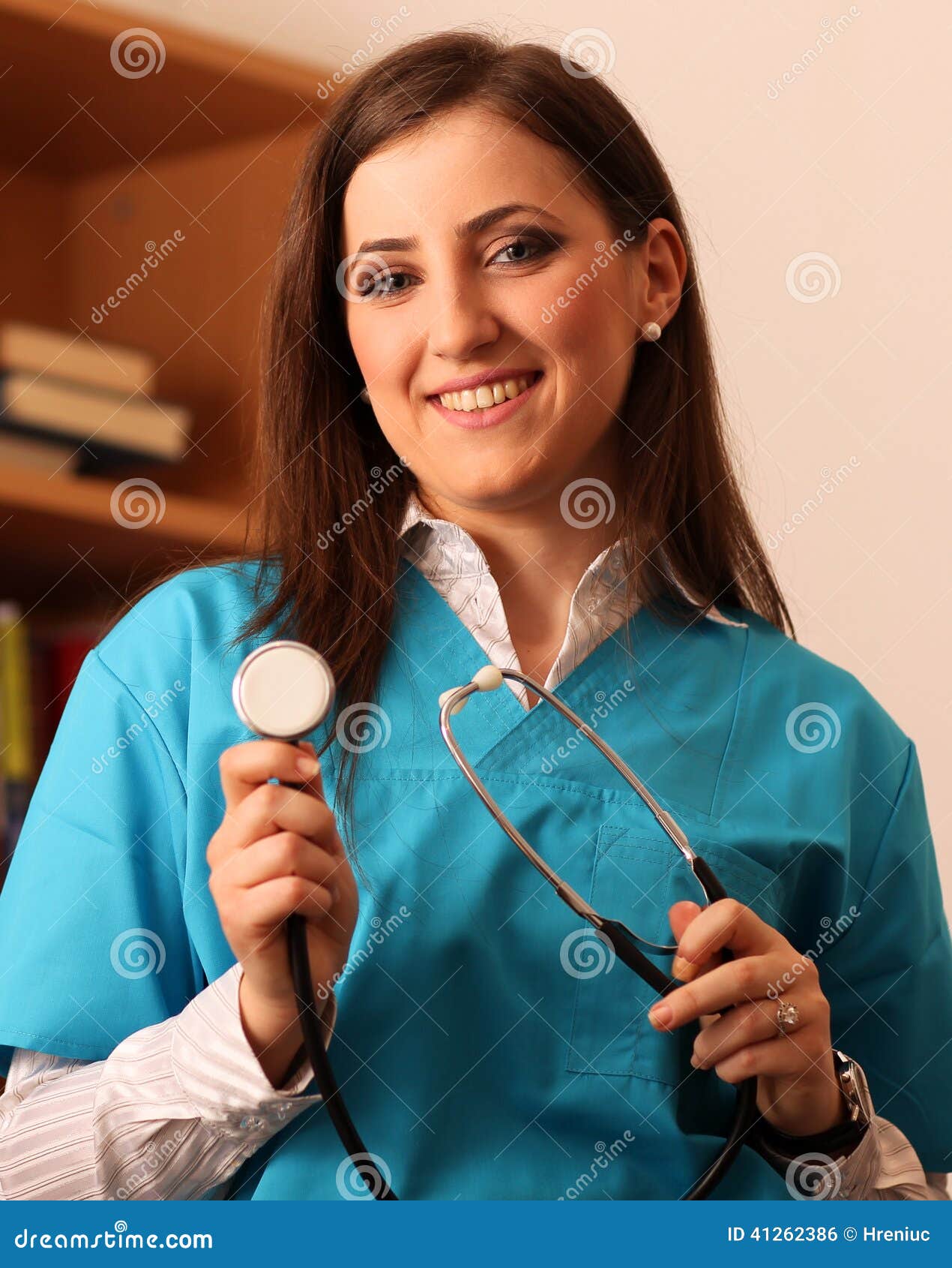 Female Doctor Smiling with Stethoscope in Hands Stock Photo - Image of ...