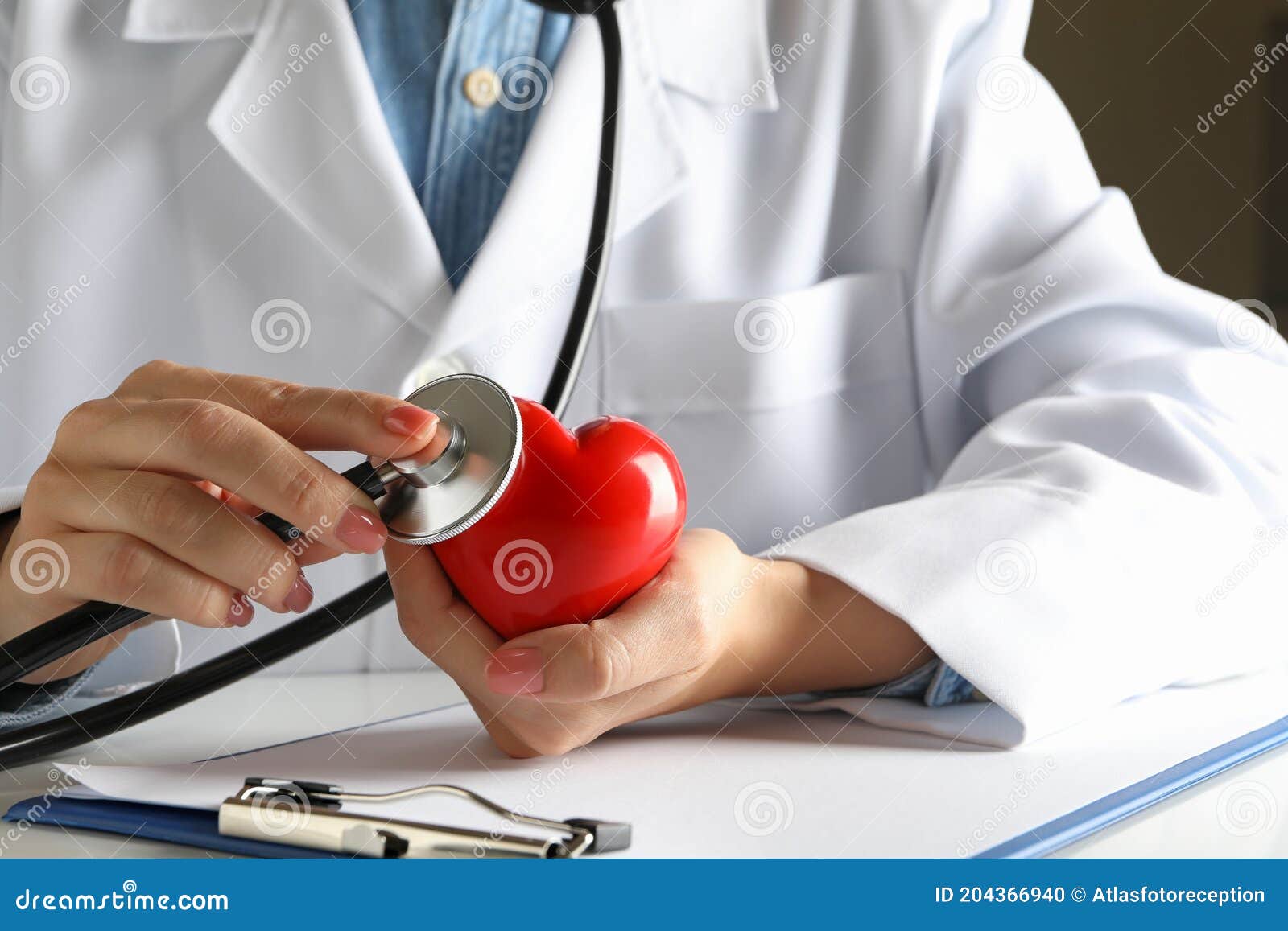 Female Doctor with Stethoscope Checking Heart Beat Stock Photo - Image ...