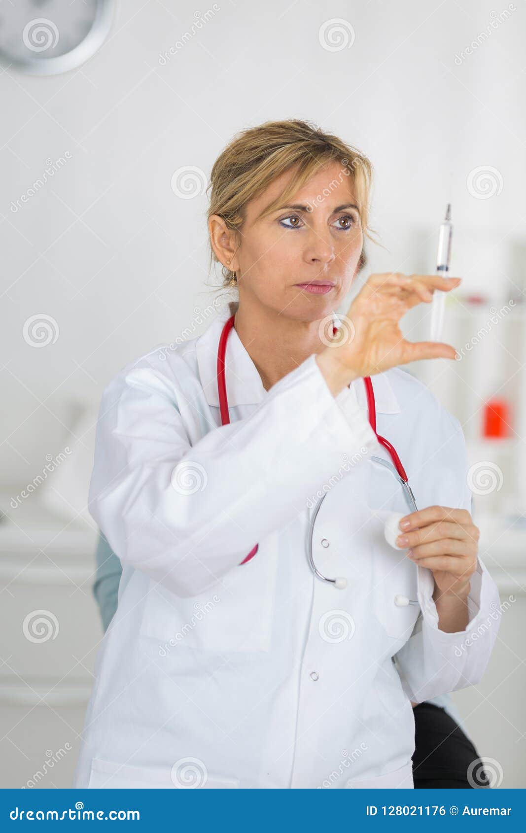 Female doctor with syringe stock photo. Image of injection - 128021176