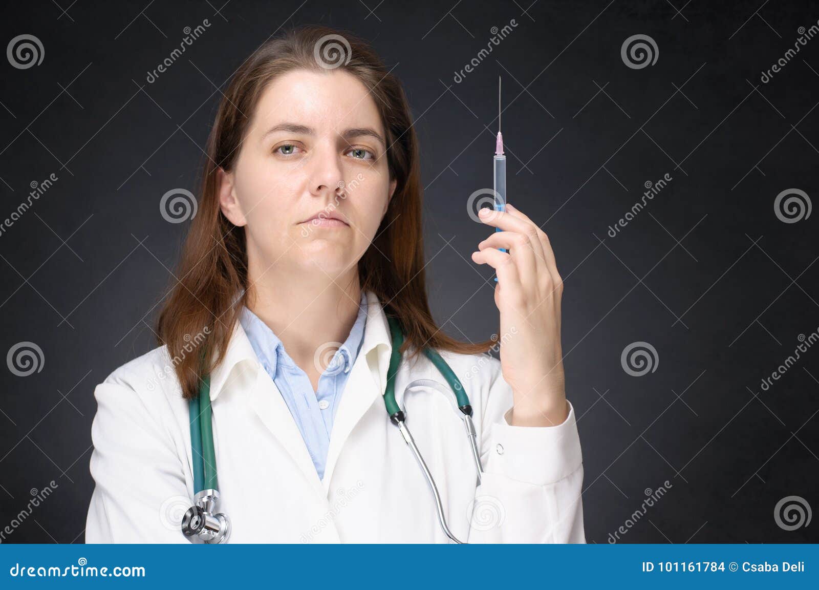 Female doctor with syringe stock photo. Image of holding - 101161784