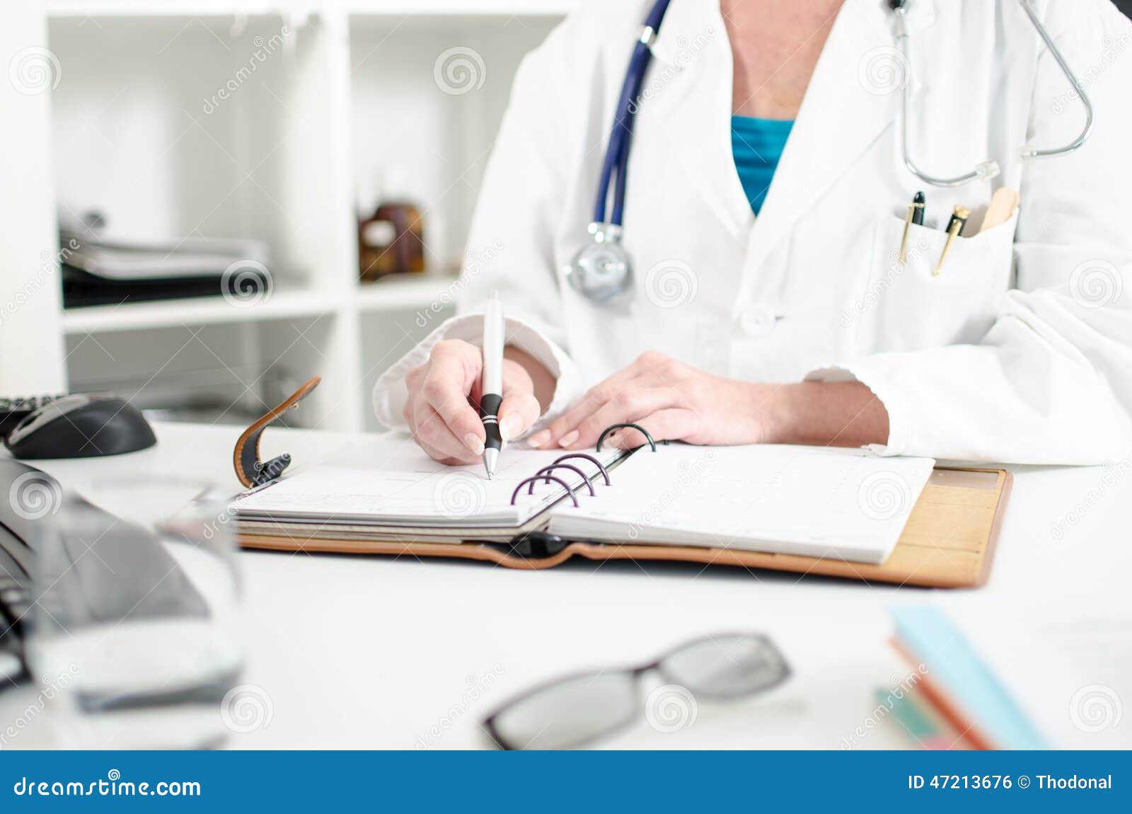 Female Doctor Taking an Appointment Stock Photo - Image of physician ...
