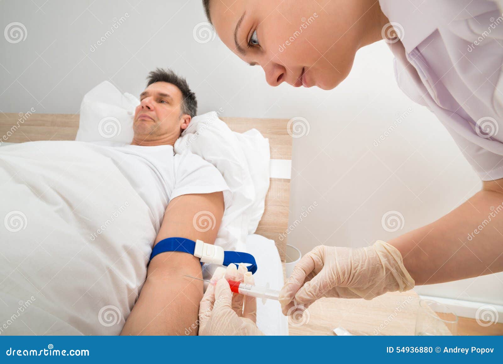 Female Doctor Taking Blood Samples of Patient Stock Photo - Image of ...