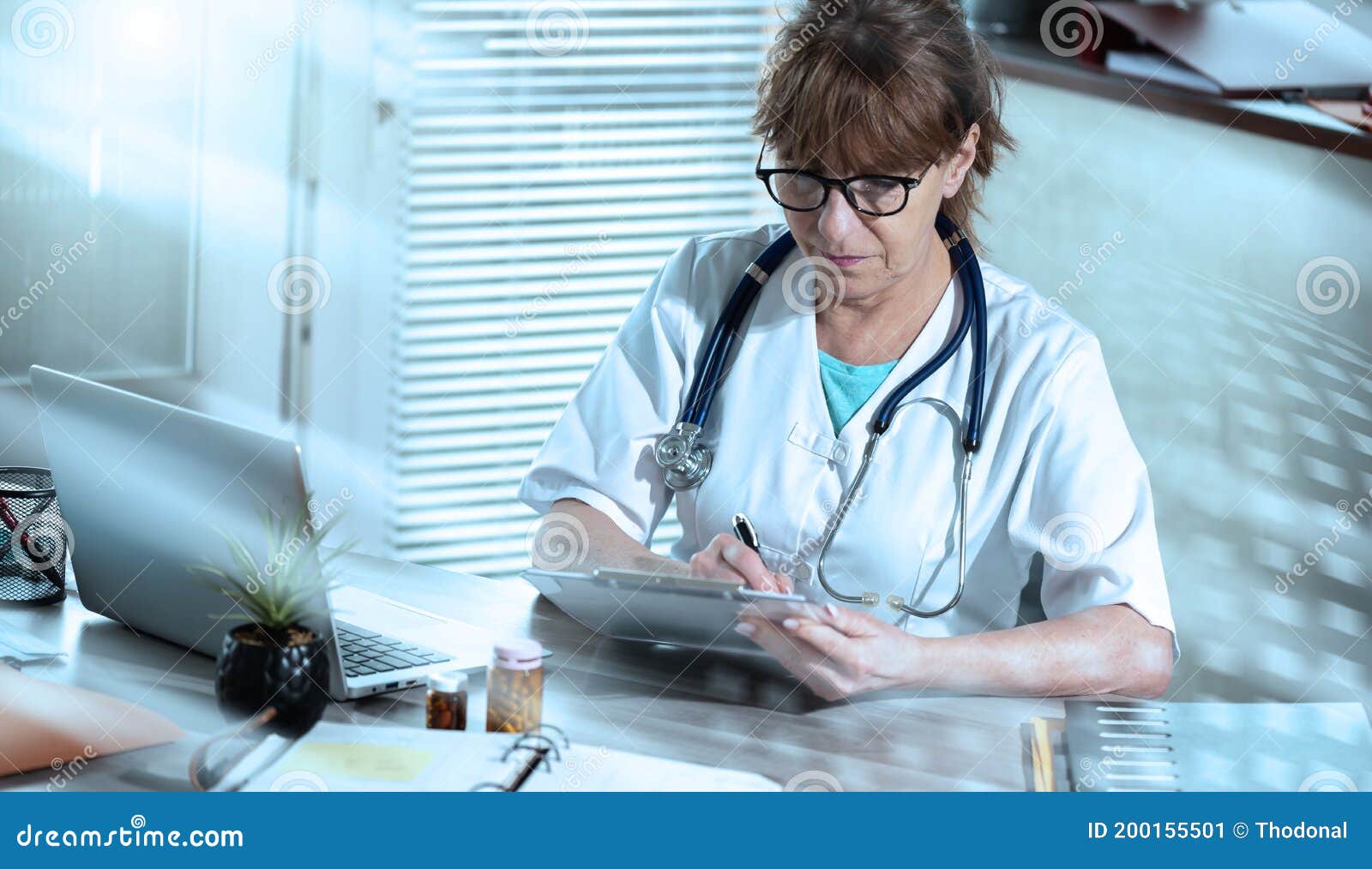 Female Doctor Taking Notes on Clipboard; Light Effect Stock Image ...