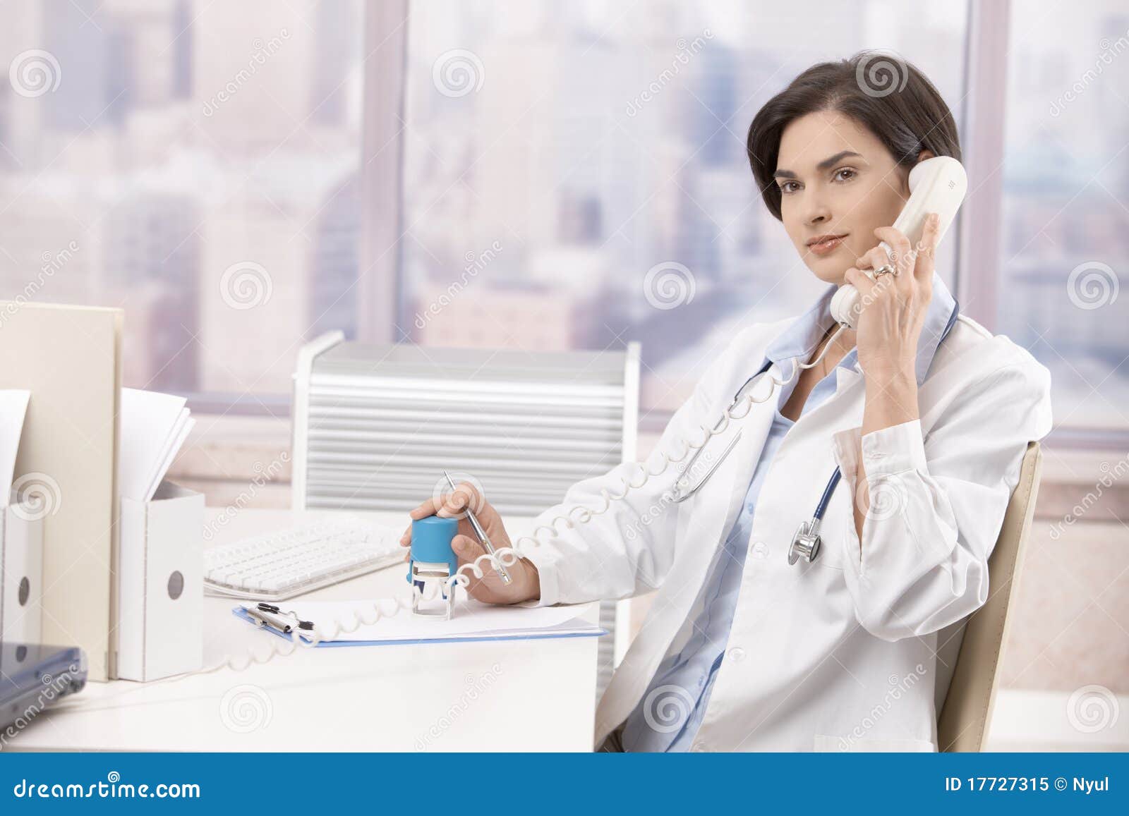 Female Doctor Talking on Phone Stock Image - Image of busy, doctor ...