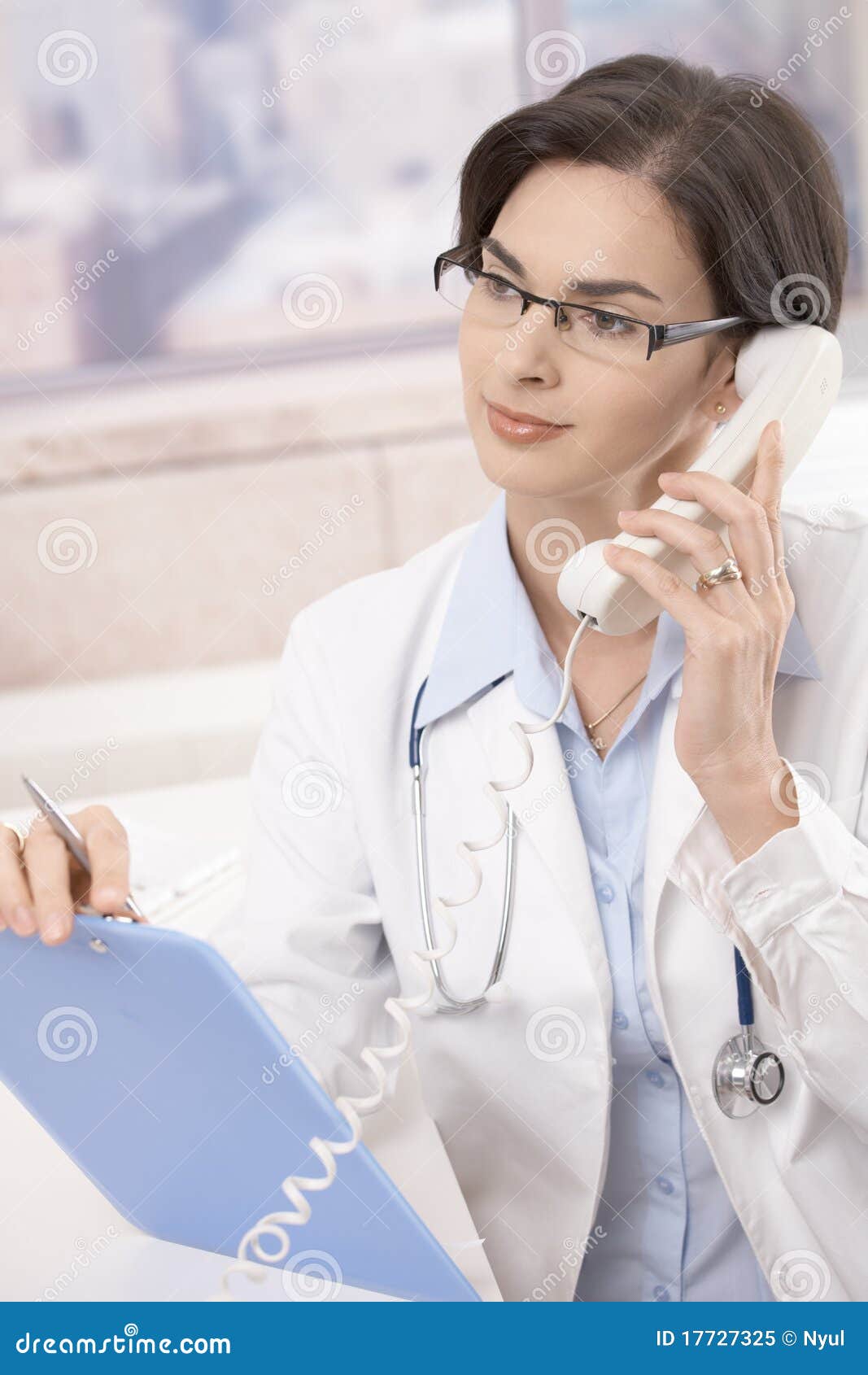 Female Doctor Talking on Phone Stock Image - Image of coat, doctors ...