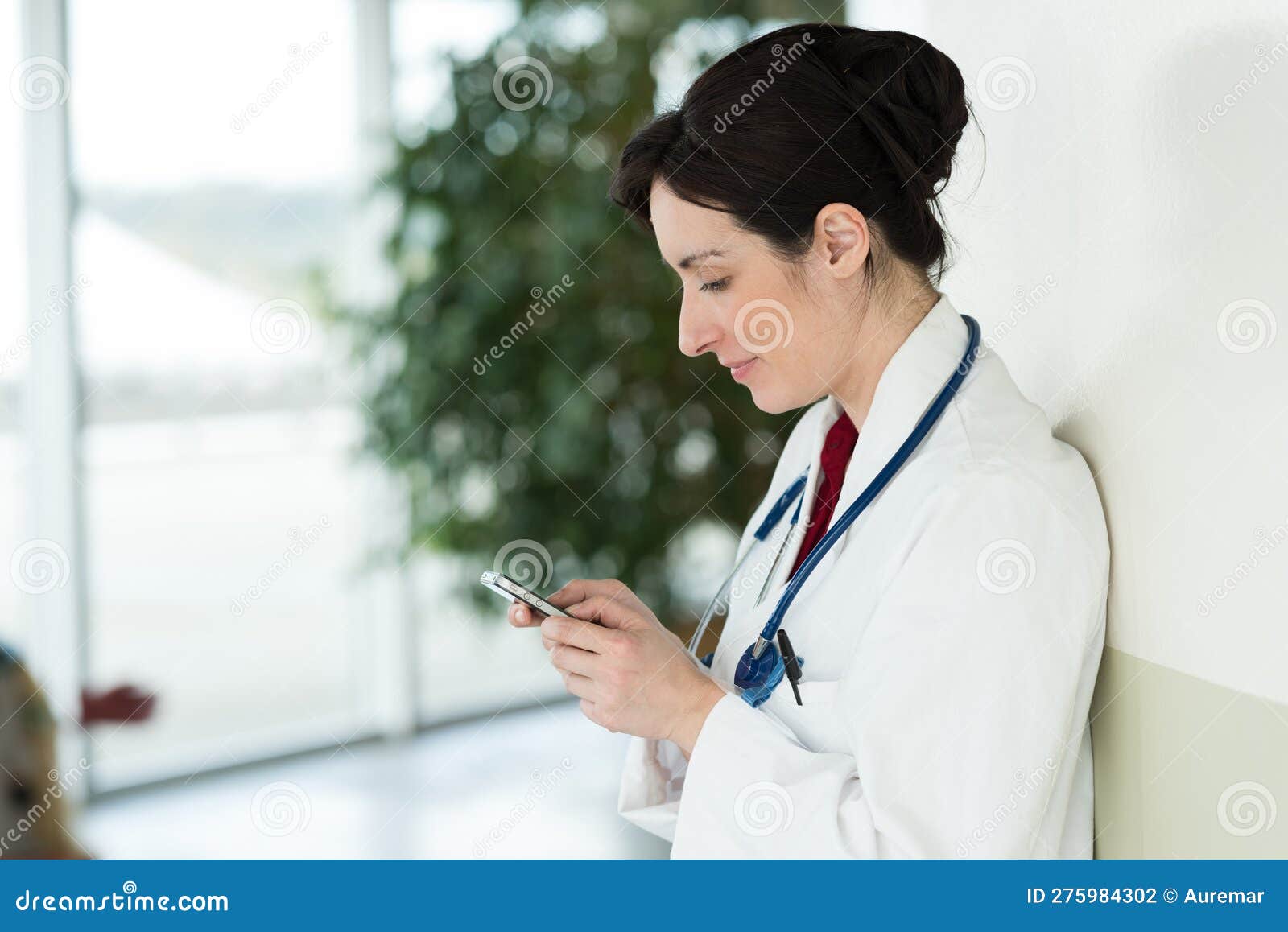 Female Doctor Texting on Smartphone Stock Photo - Image of office ...