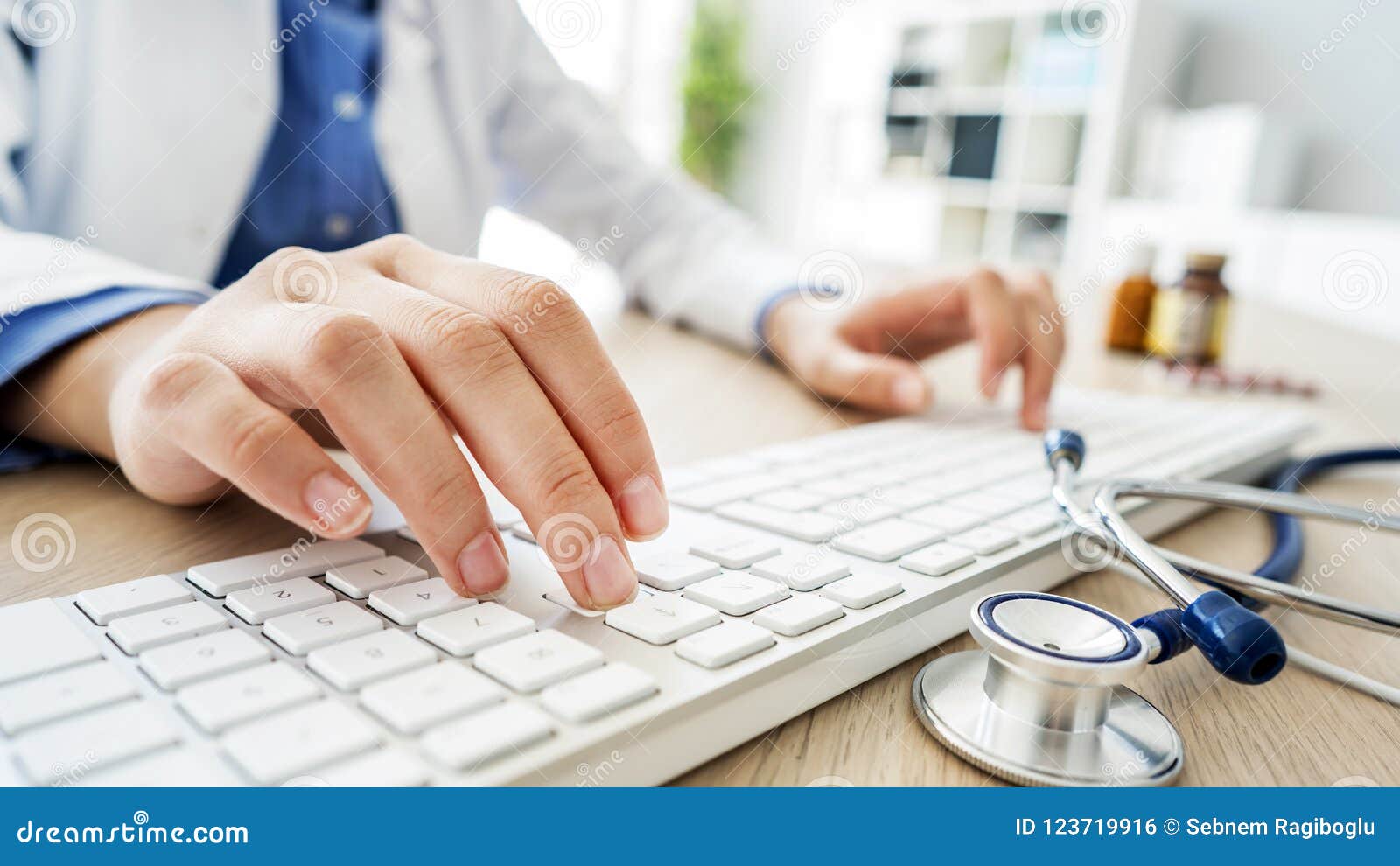 Female Doctor Typing on Computer Stock Photo - Image of medicine ...