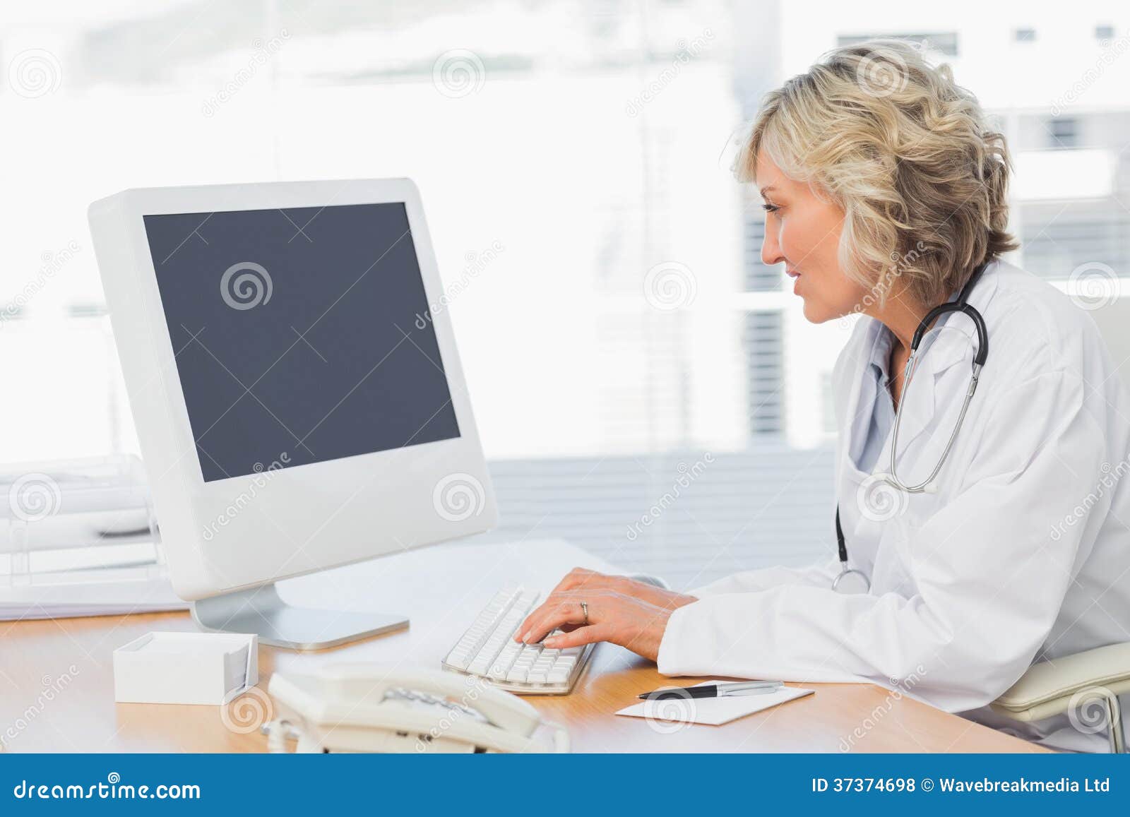 Female Doctor Using Computer in Medical Office Stock Photo - Image of ... Female Doctor Using Computer in Medical Office Stock Photo - Image of ...