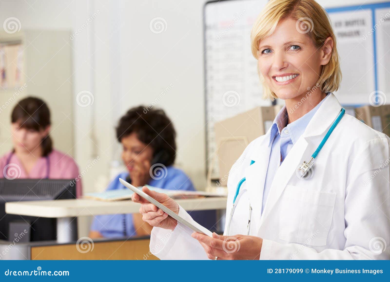 Female Doctor Using Digital Tablet at Nurses Station Stock Image ...
