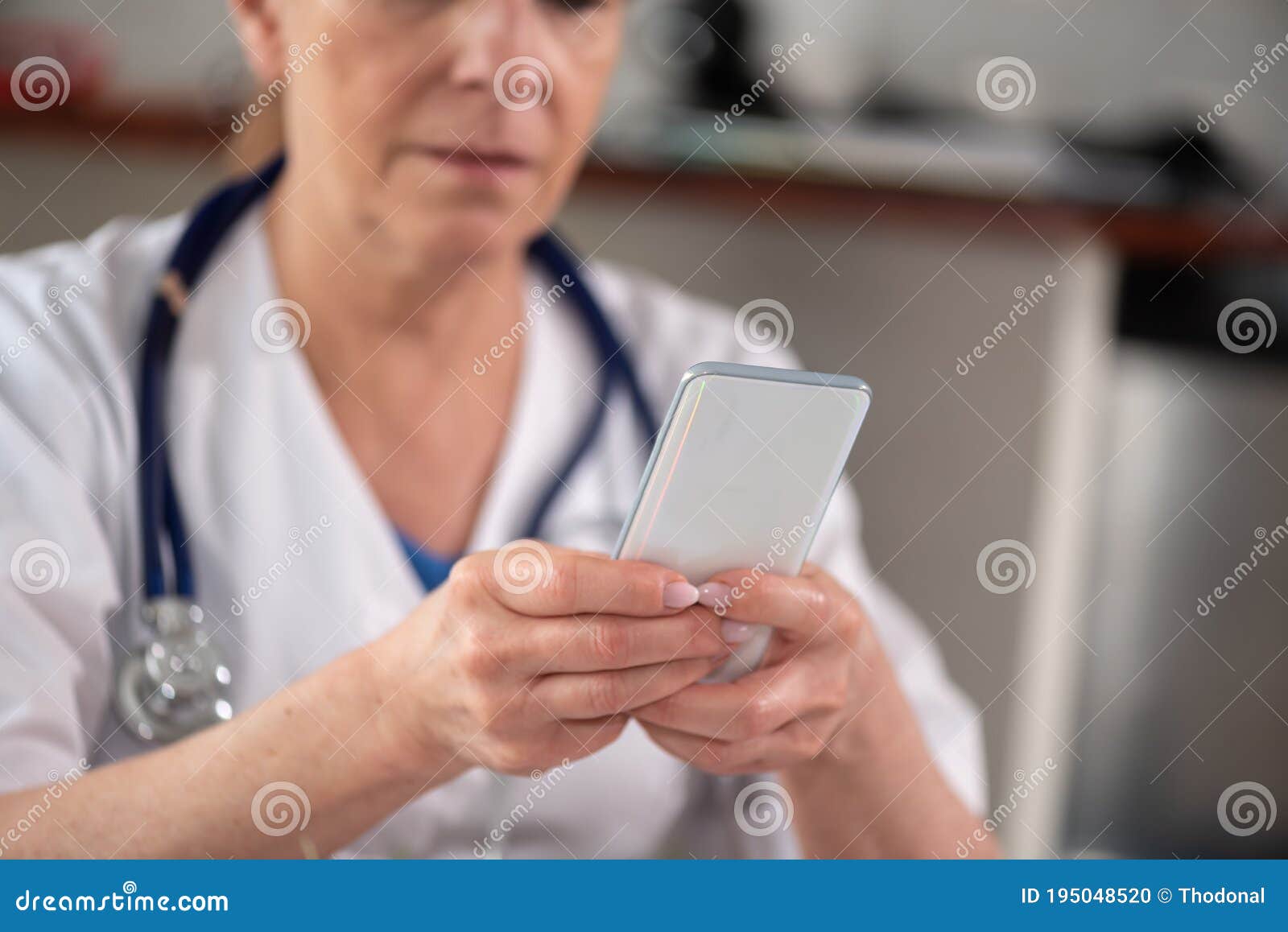 Female Doctor Using Her Mobile Phone Stock Photo - Image of healthcare ...