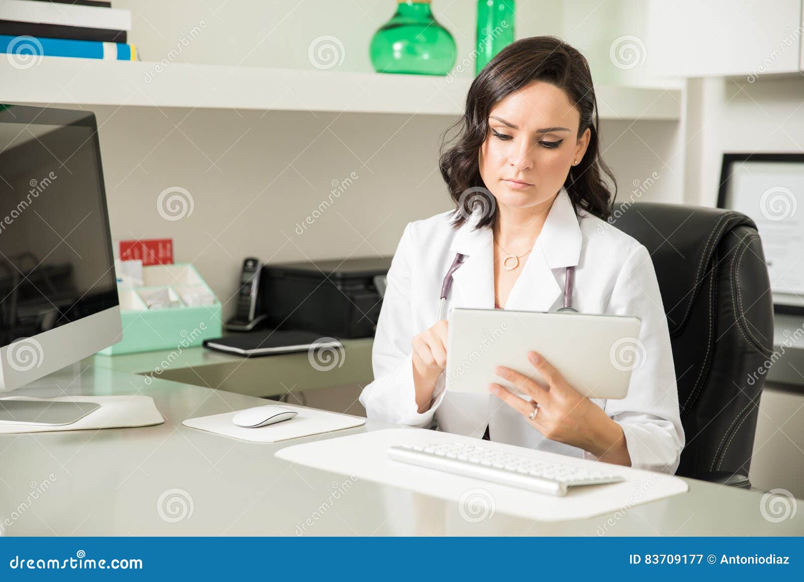 Female Doctor Using Technology in Her Office Stock Image - Image of ...