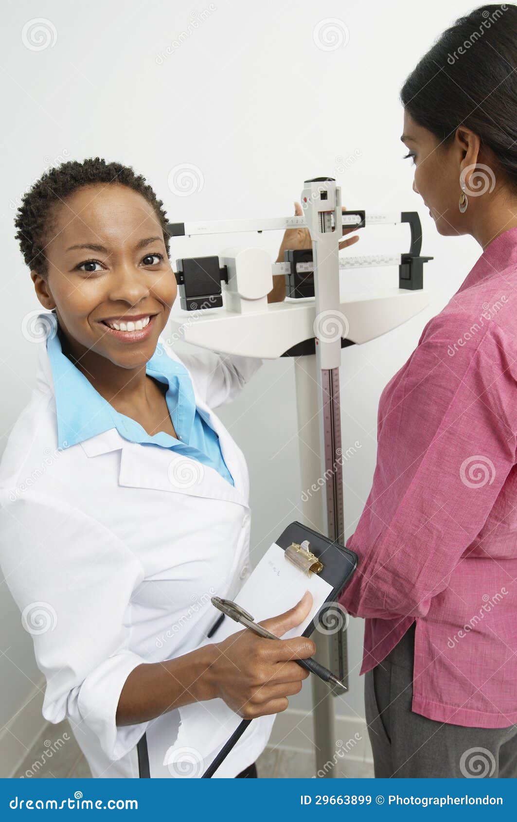 Female Doctor Weighing Patient Stock Image - Image of american ...